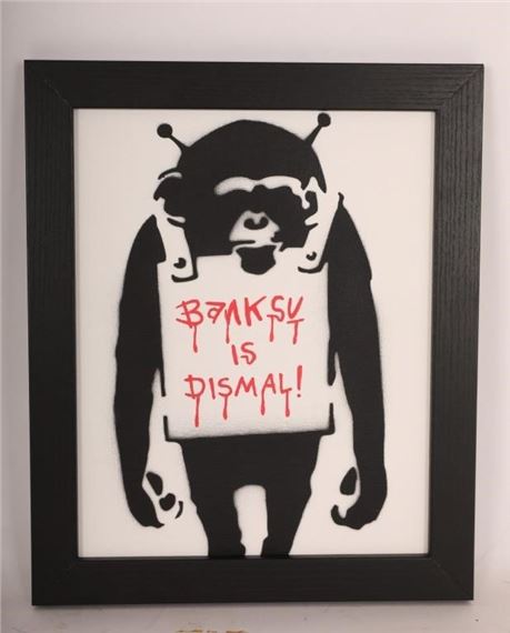 Banksy | Dismaland of monkey wearing sign that reads Banksy is Dismal ...