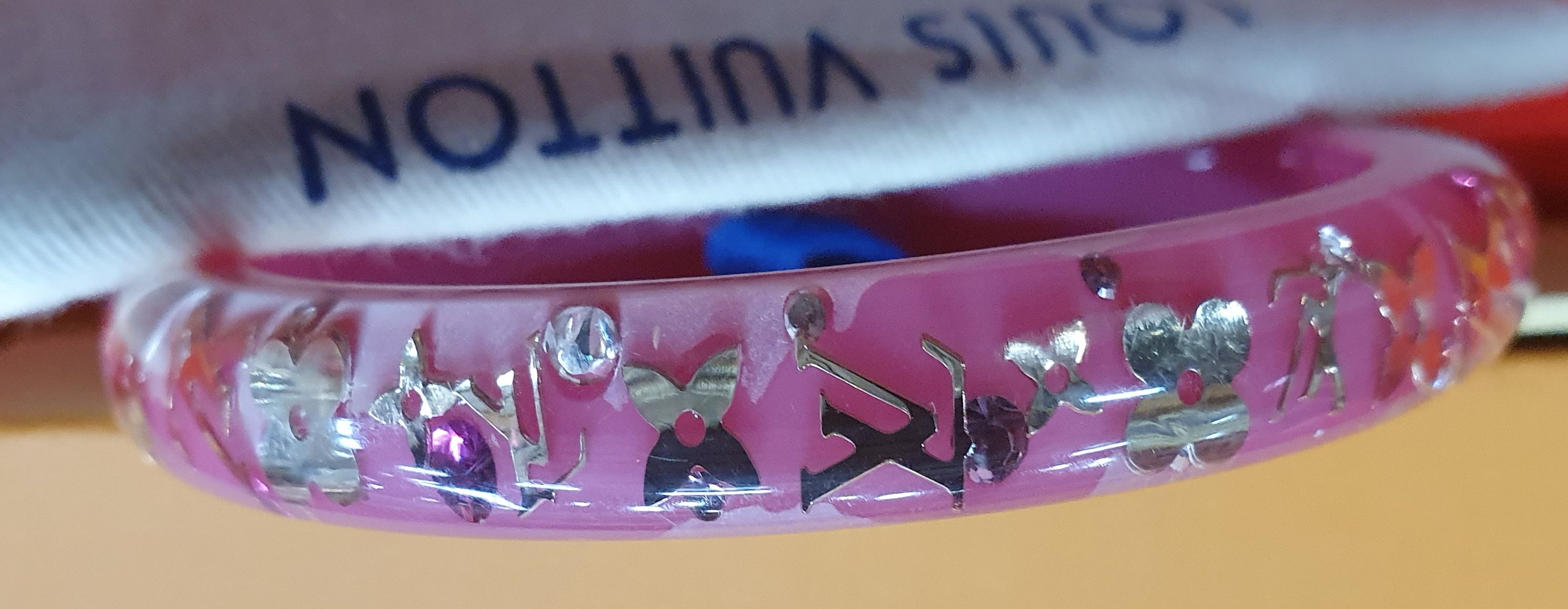 Louis Vuitton | A LOUIS VUITTON PINK INCLUSION BANGLE | MutualArt