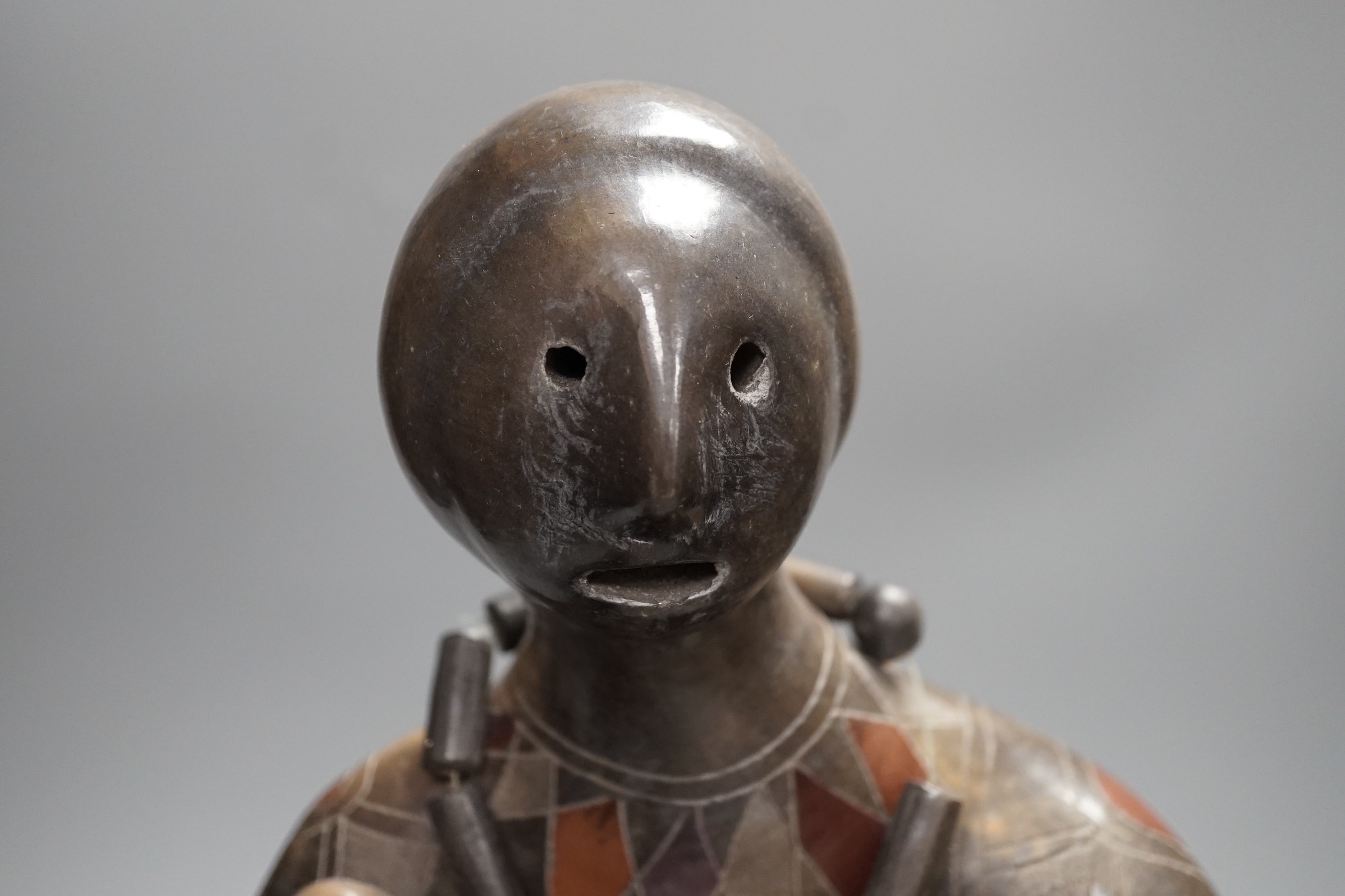 Manuel Felguérez | a terracotta abstract sculpture of a seated woman ...