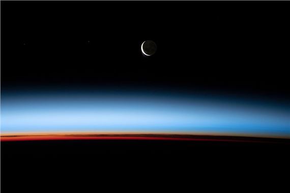NASA | This beautiful photograph shows a crescent moon hovering over an ...