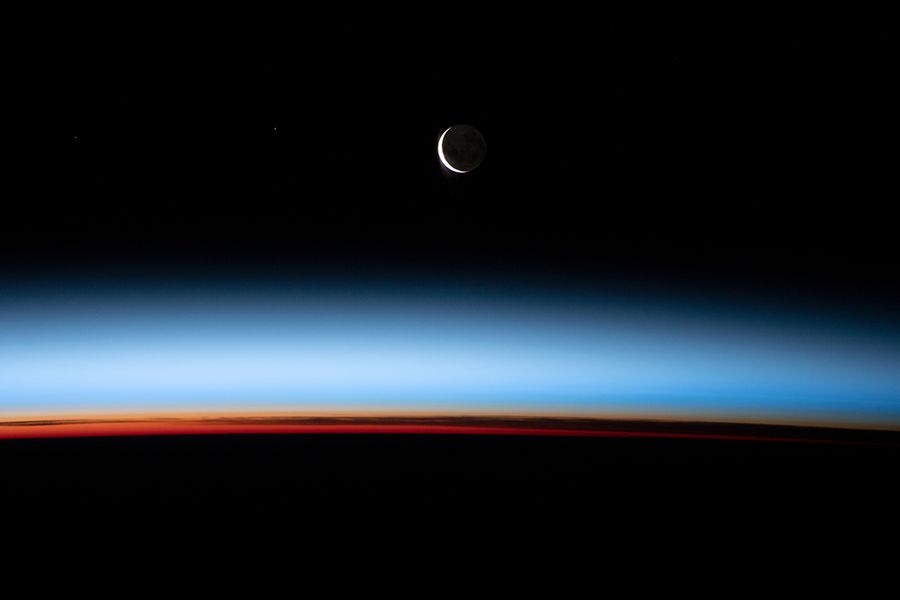 NASA | This beautiful photograph shows a crescent moon hovering over an ...