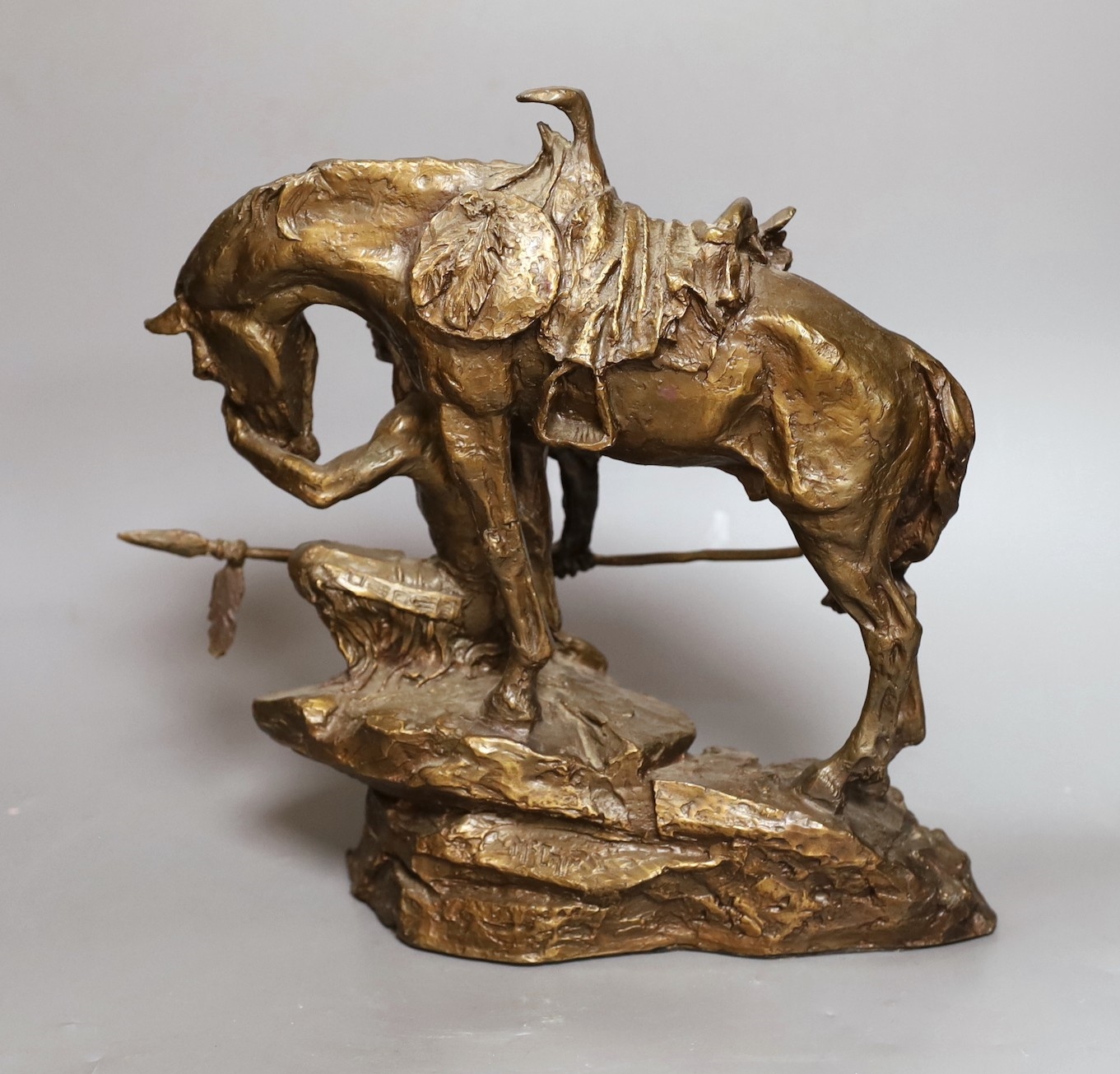 Buck McCain | A bronze figure group of a Native American kneeling next ...