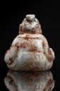 Han Dynasty | A VERY RARE CALCIFIED JADE FIGURE OF A SEATED MAN | MutualArt