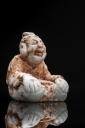 Han Dynasty | A VERY RARE CALCIFIED JADE FIGURE OF A SEATED MAN | MutualArt