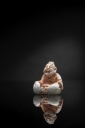 Han Dynasty | A VERY RARE CALCIFIED JADE FIGURE OF A SEATED MAN | MutualArt