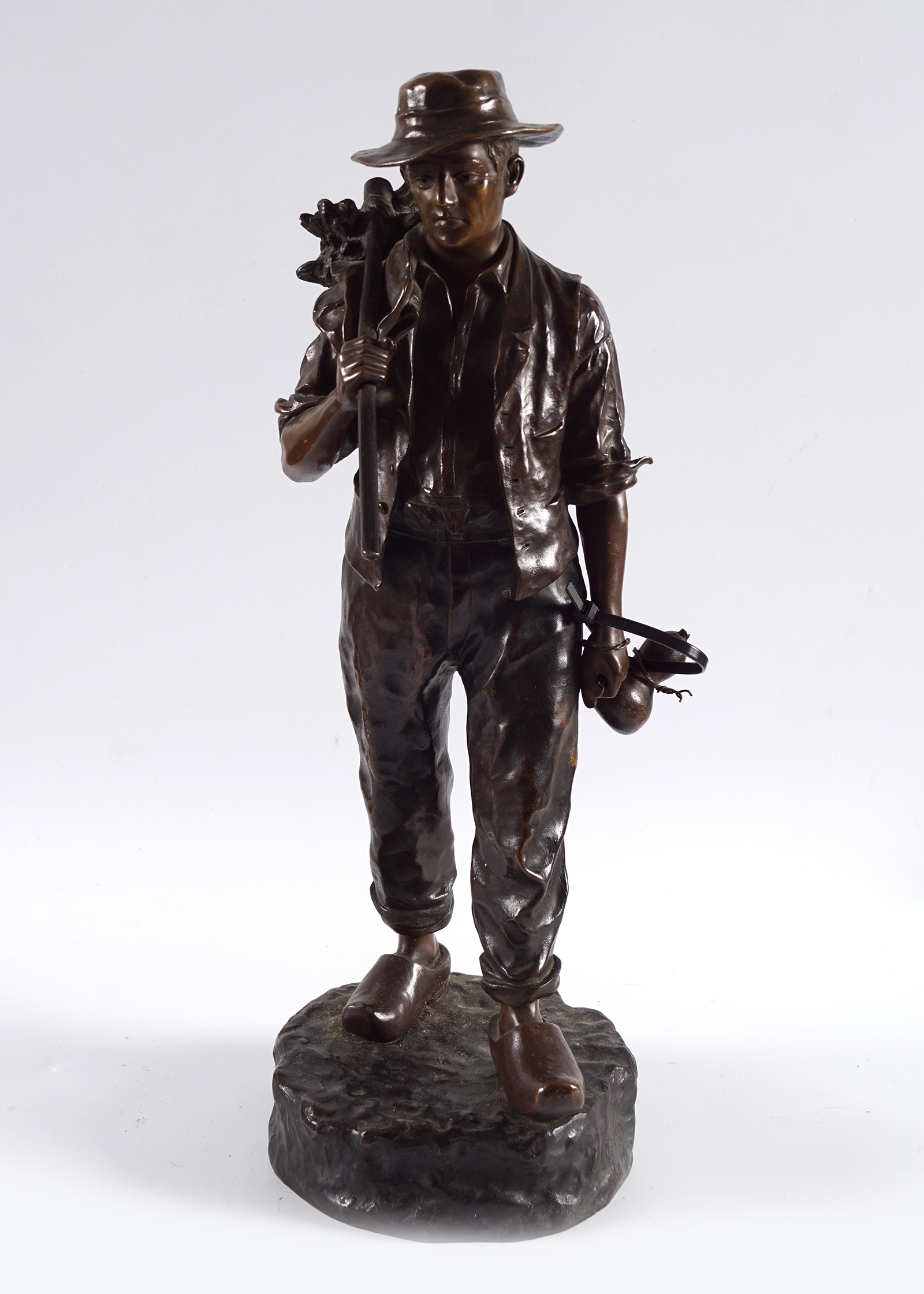 J. Garnier | Figure holding a pitchfork and a double gourd bottle ...
