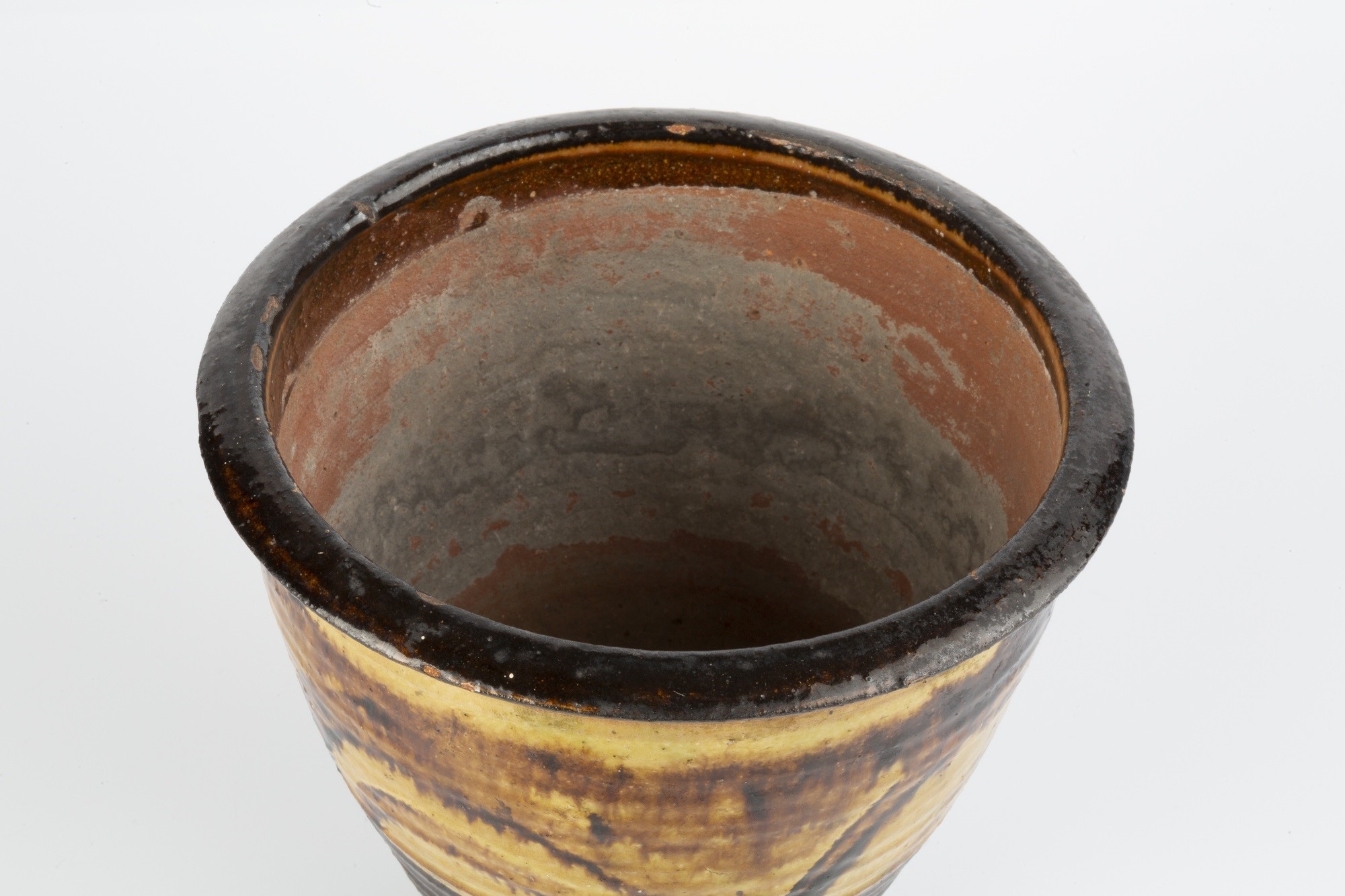 Ray Finch | An early pot slipware with yellow and dark glaze | MutualArt