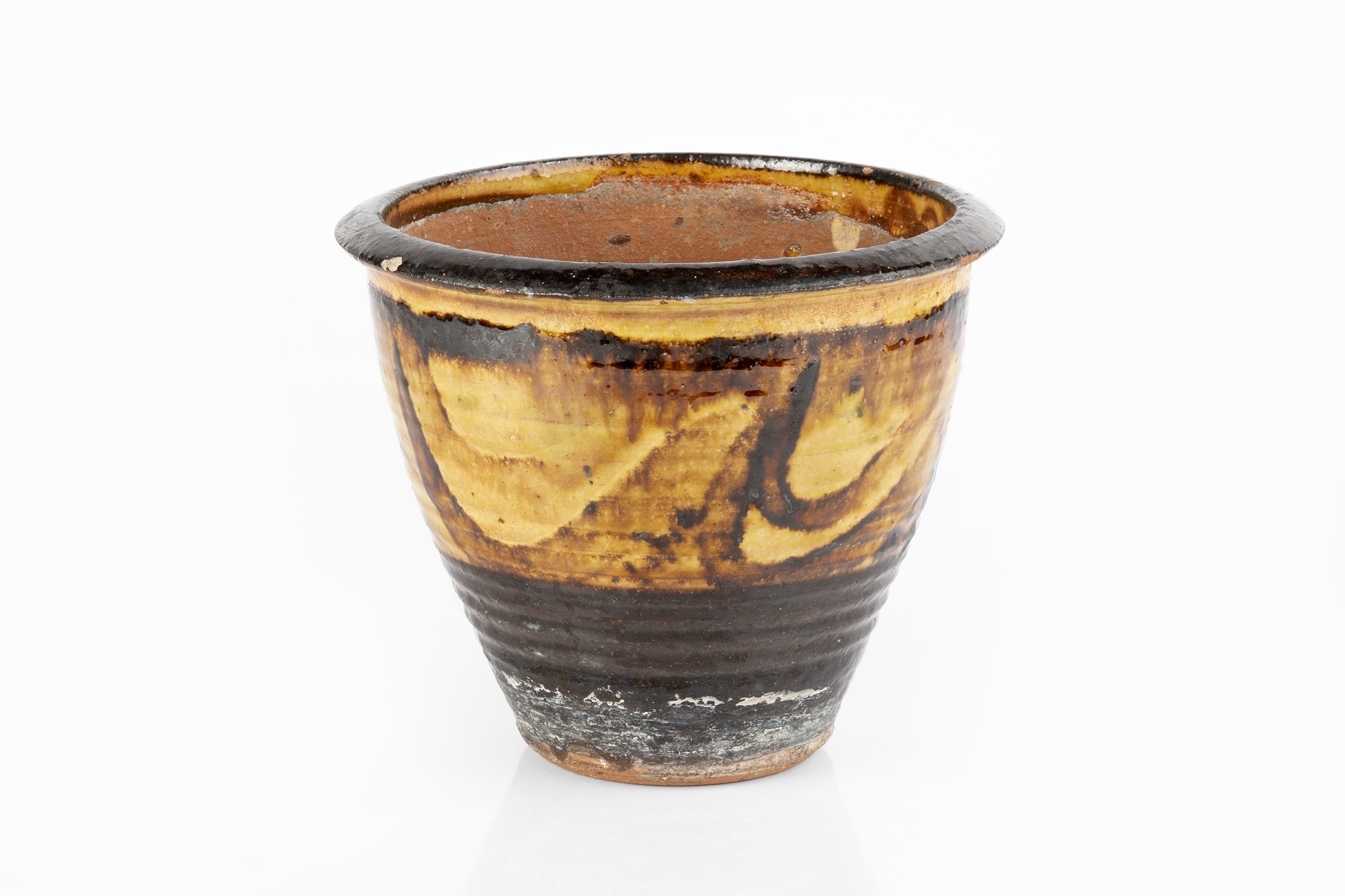 Ray Finch | An early pot slipware with yellow and dark glaze | MutualArt