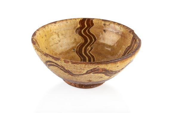 Michael Cardew | An early bowl honey glaze with a wavey pattern | MutualArt