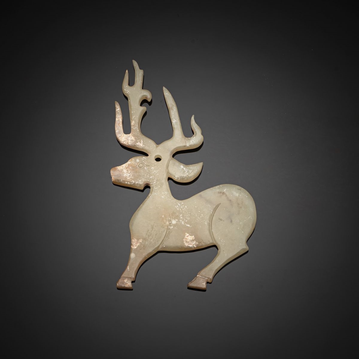 Zhou Dynasty | A RARE STAG-FORM LIGHT GREEN JADE PENDANT (1995) | MutualArt