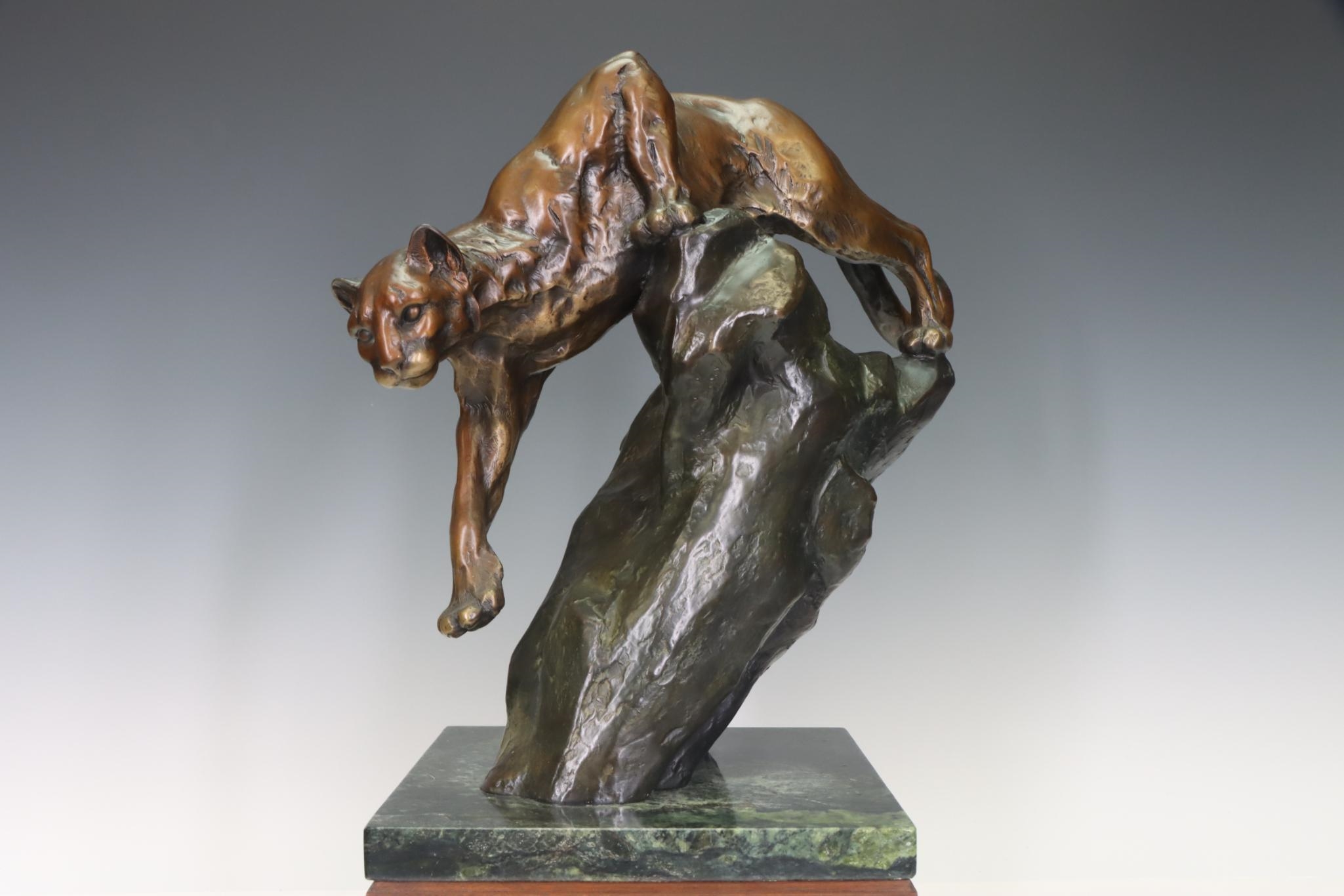 Dawn Weimer | depicting a mountain lion mounted to a marble slab on a ...