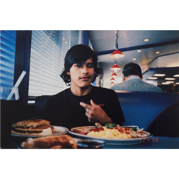 Larry Clark | JONATHAN VELASQUEZ IN A DINER - 1998 | MutualArt