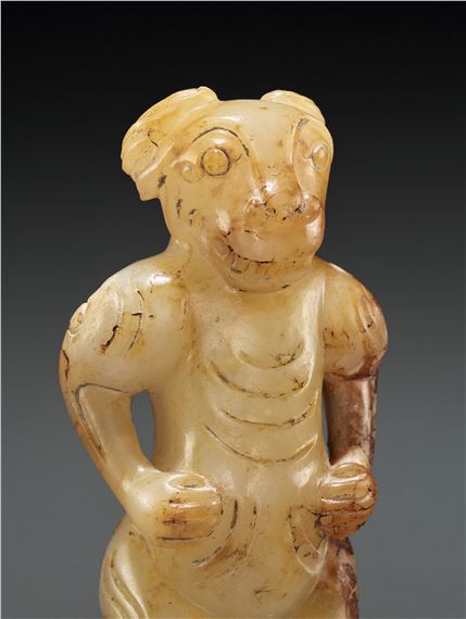 Han Dynasty | A YELLOW AND RUSSET JADE FIGURE WITH A RAM’S HEAD | MutualArt