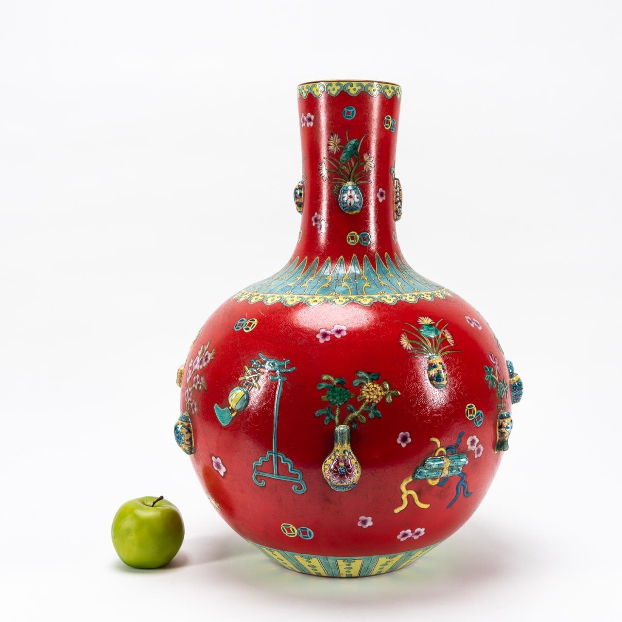 Qianlong | CHINESE RED GROUND PRECIOUS OBJECTS BOTTLE VASE | MutualArt