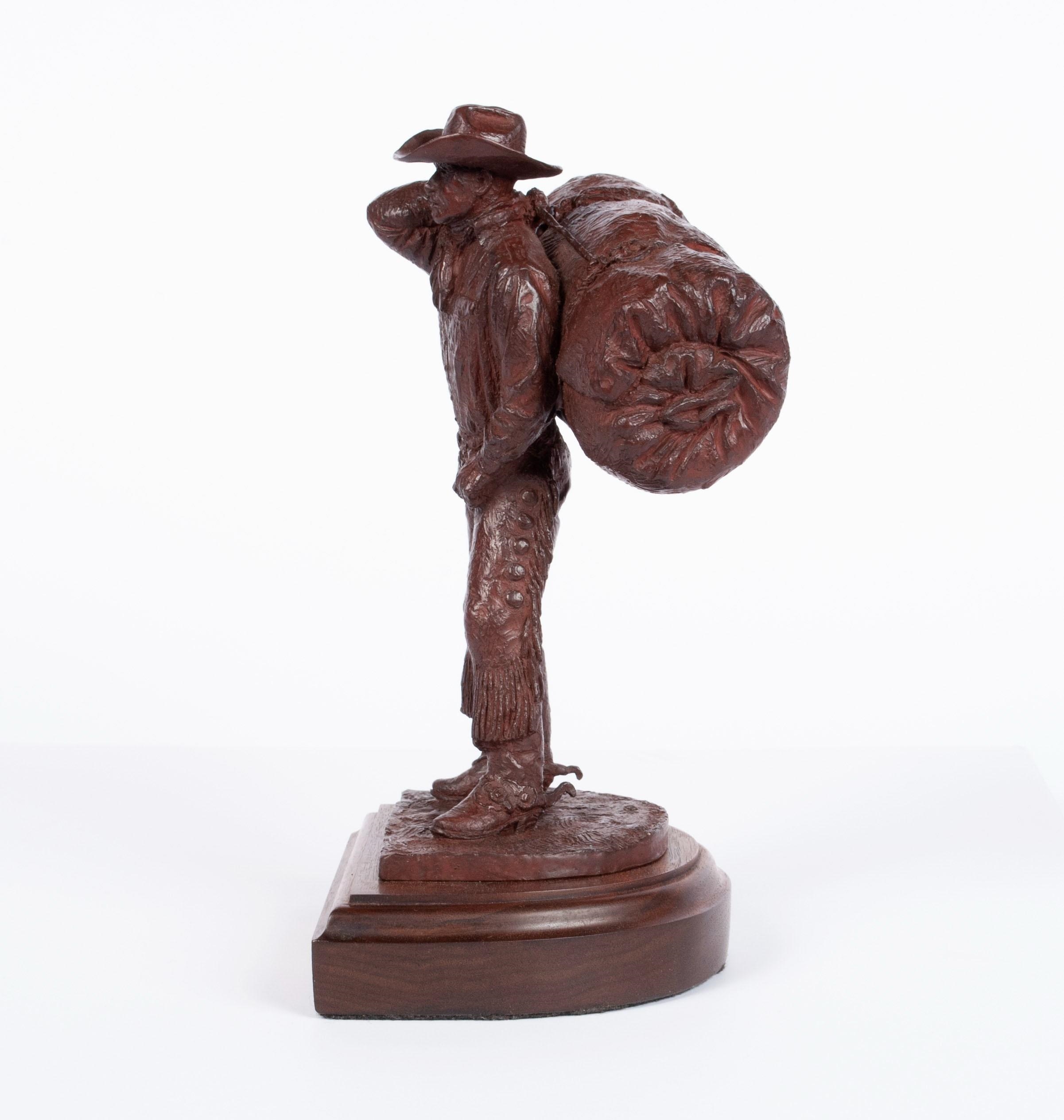 Harold Holden | Desktop bronze of a cowboy with sack roll over one ...