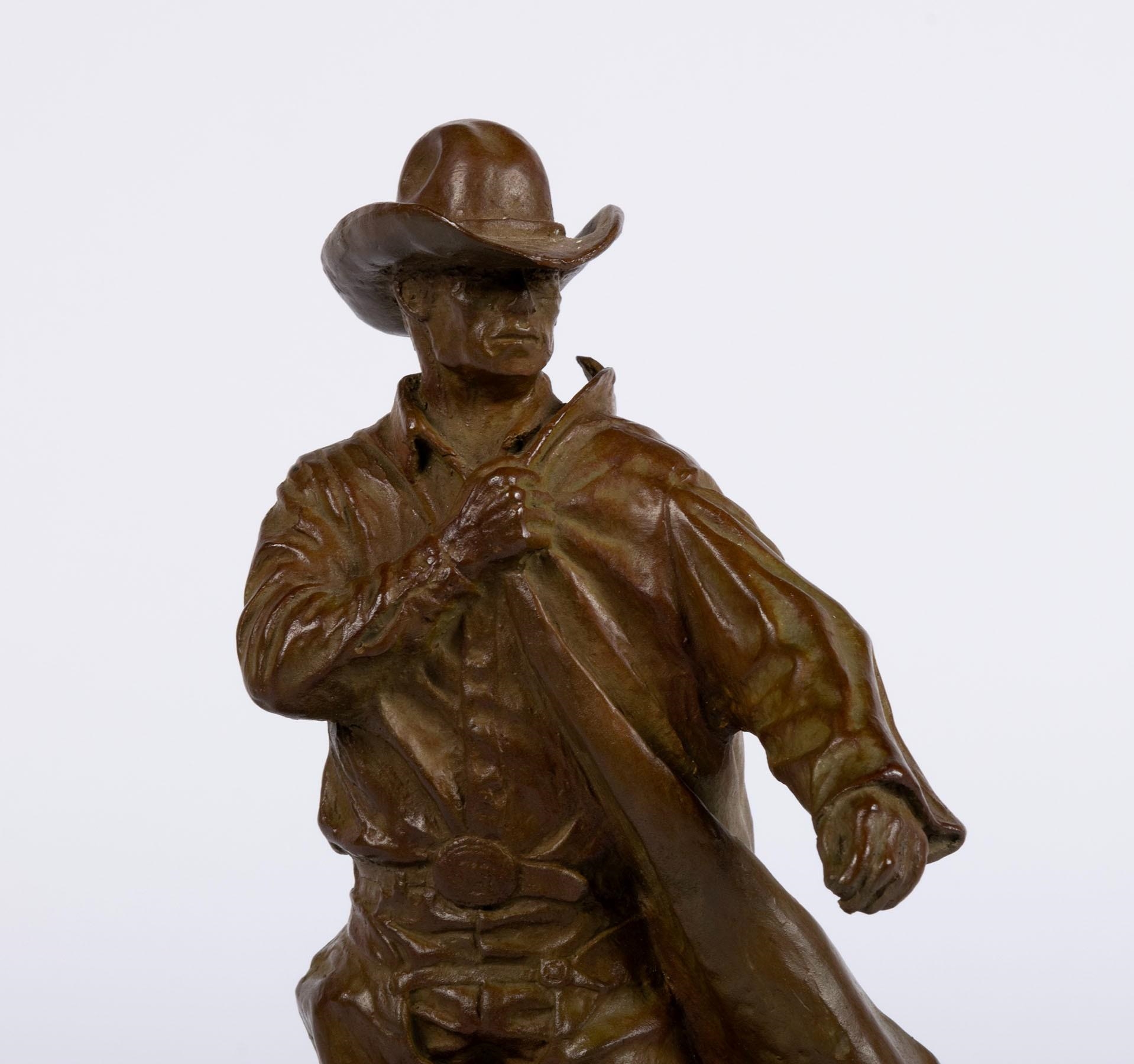 Harold Holden | Small bronze of cowboy putting on his duster (1940 ...