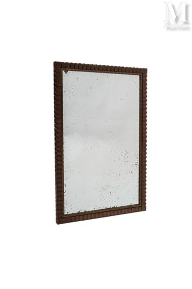 Andre Dubreuil | Rectangular mirror frame in patinated steel decorated with oves | MutualArt