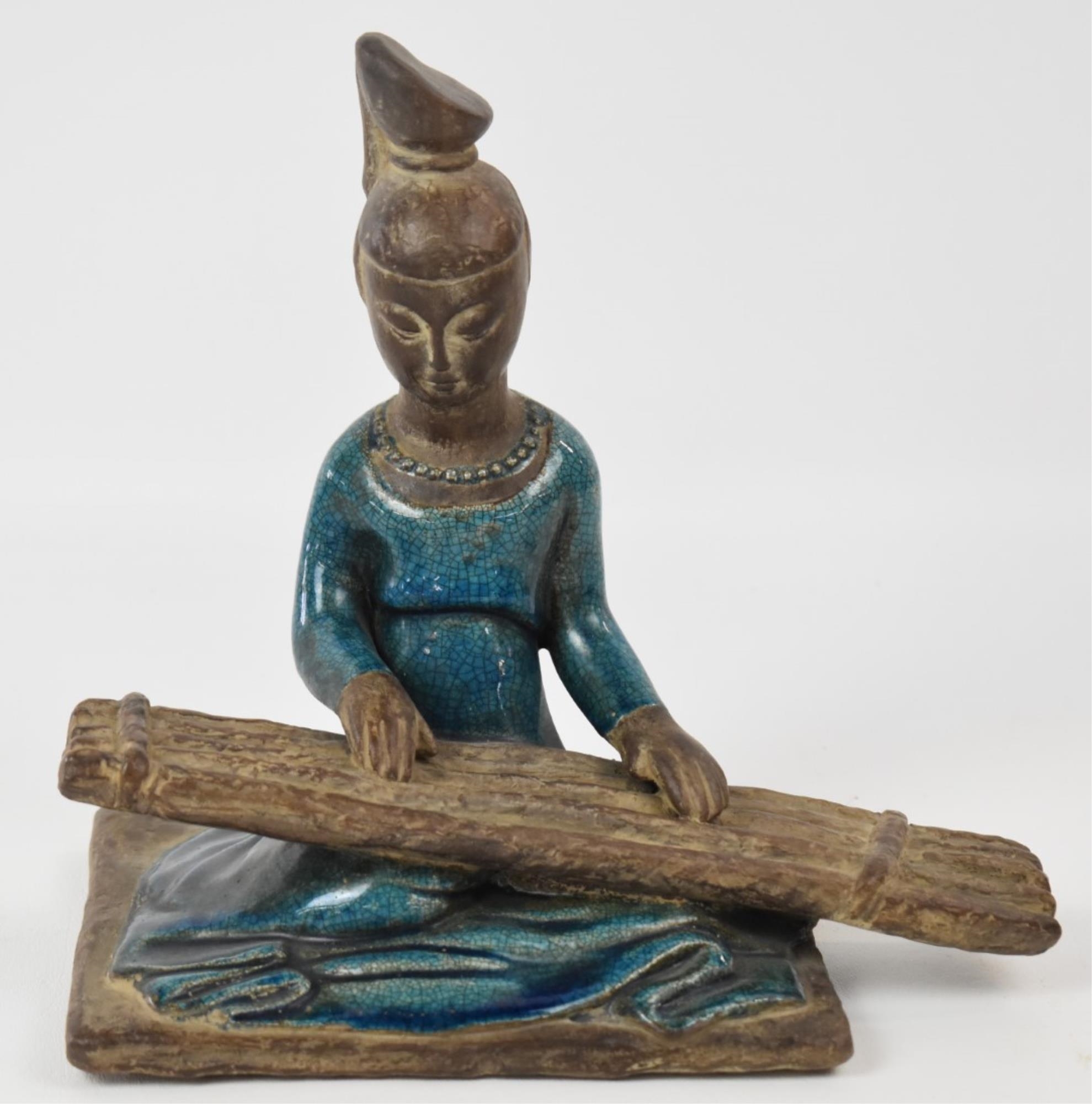 Ugo Zaccagnini | signed on base. Features geisha figure playing zither ...