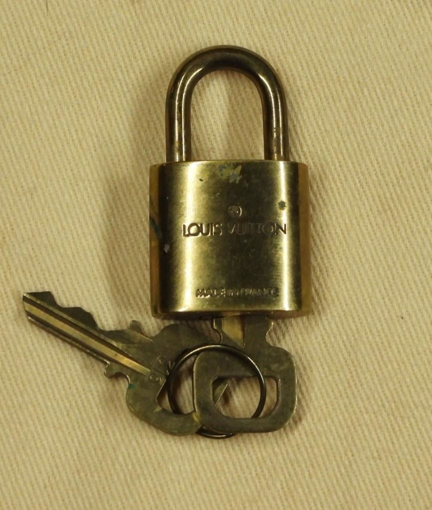 Louis Vuitton | Louis Vuitton Brass Lock and Key Set | MutualArt