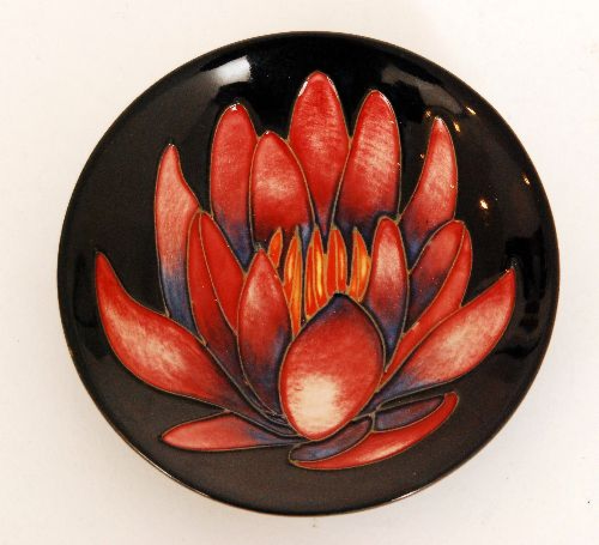 William Moorcroft | A small Moorcroft Pottery pin dish decorated in the ...