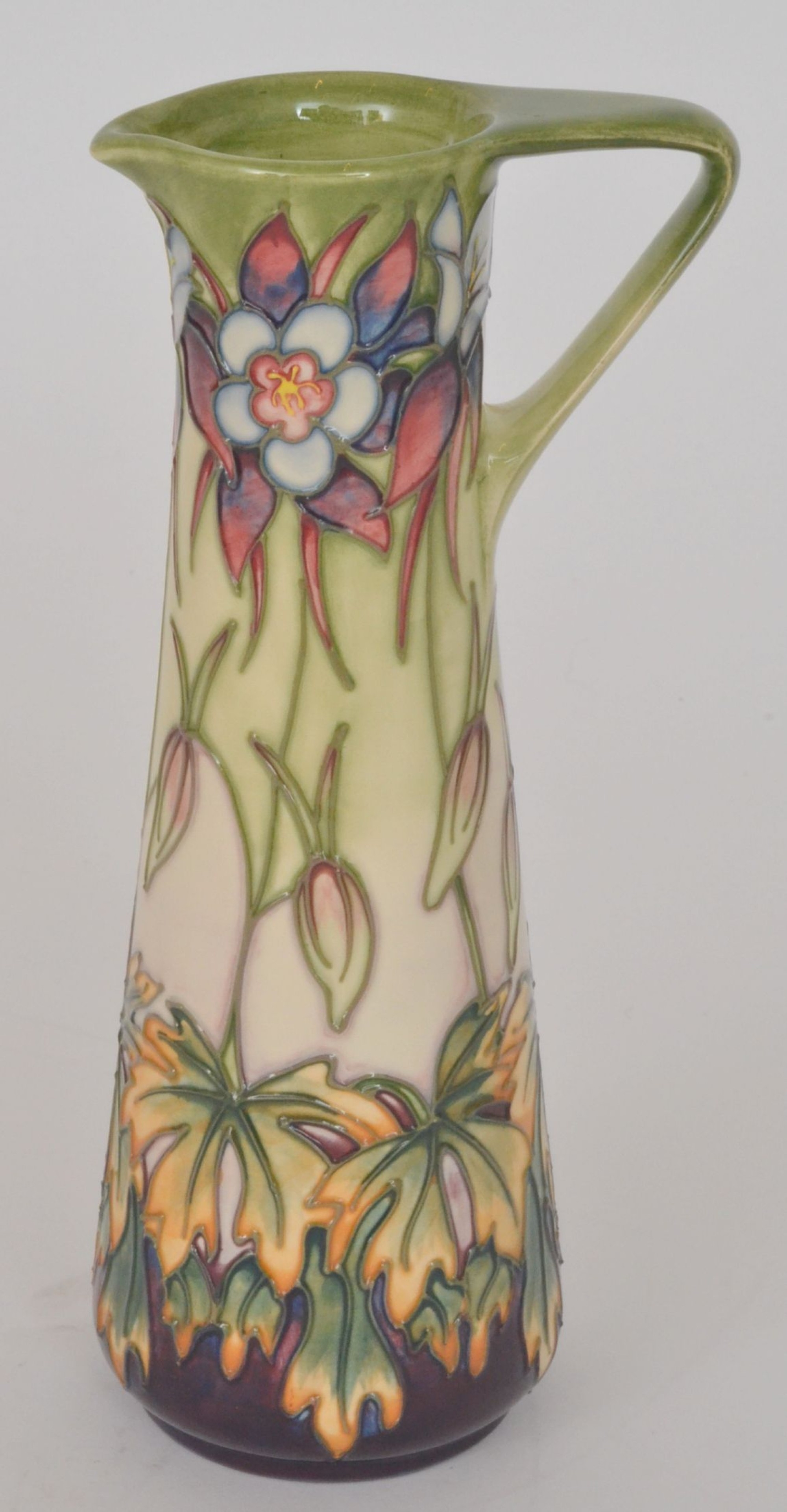 William Moorcroft | A Moorcroft Pottery ewer in the Aquilegia pattern ...