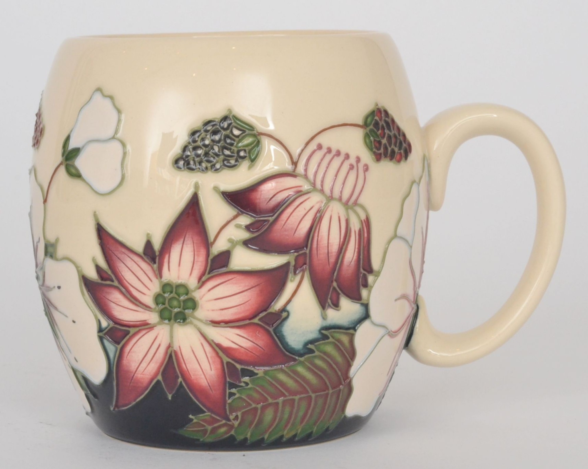 William Moorcroft | A Moorcroft Pottery boxed mug decorated in the ...