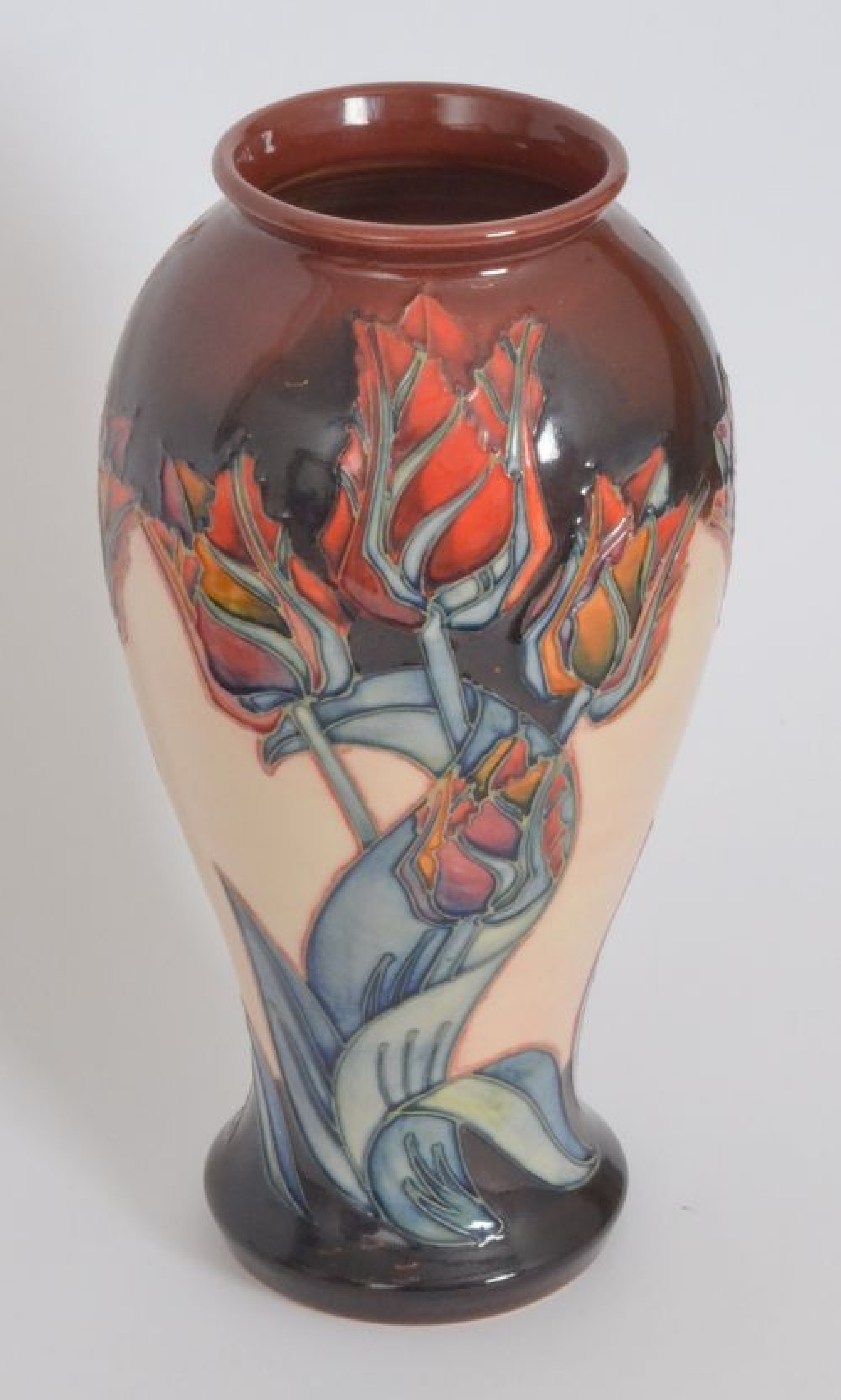 William Moorcroft | A Moorcroft Pottery vase of slender high shouldered ...