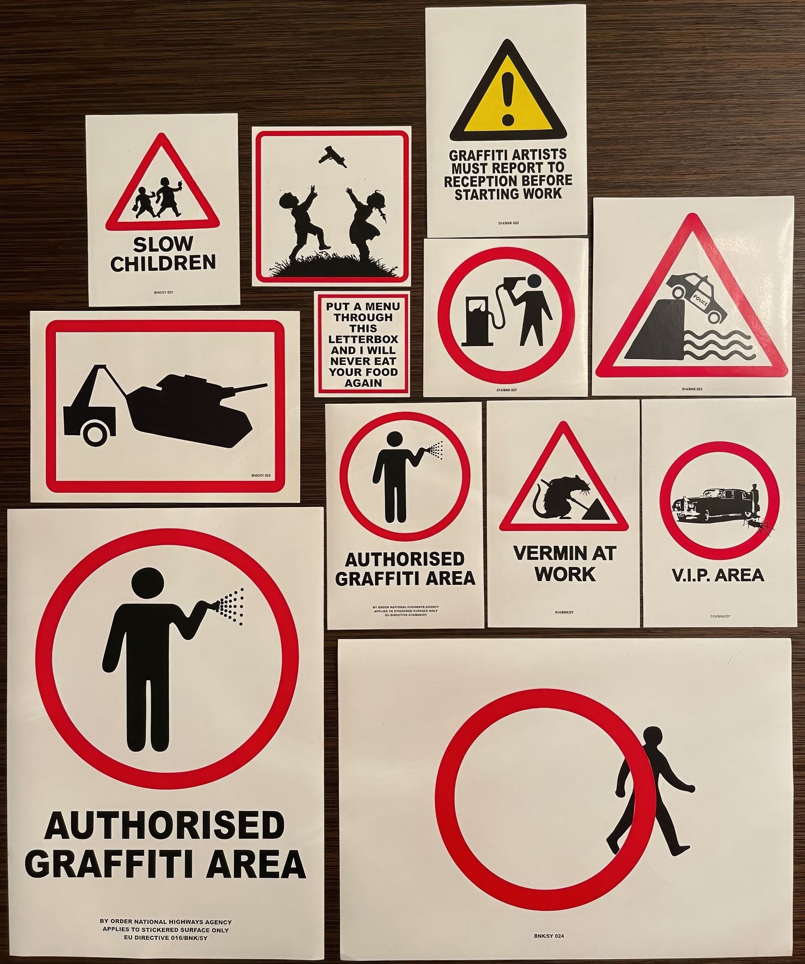 Banksy | Banksy (after), a lot of 12 screen printing stickers ...