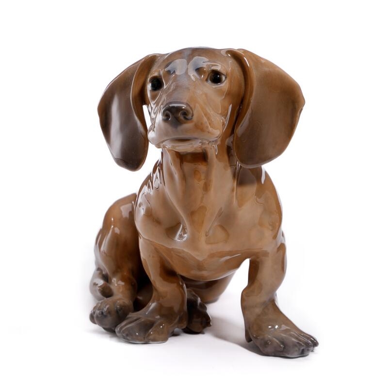 Erik Nielsen | A porcelain figure of a dachshund | MutualArt
