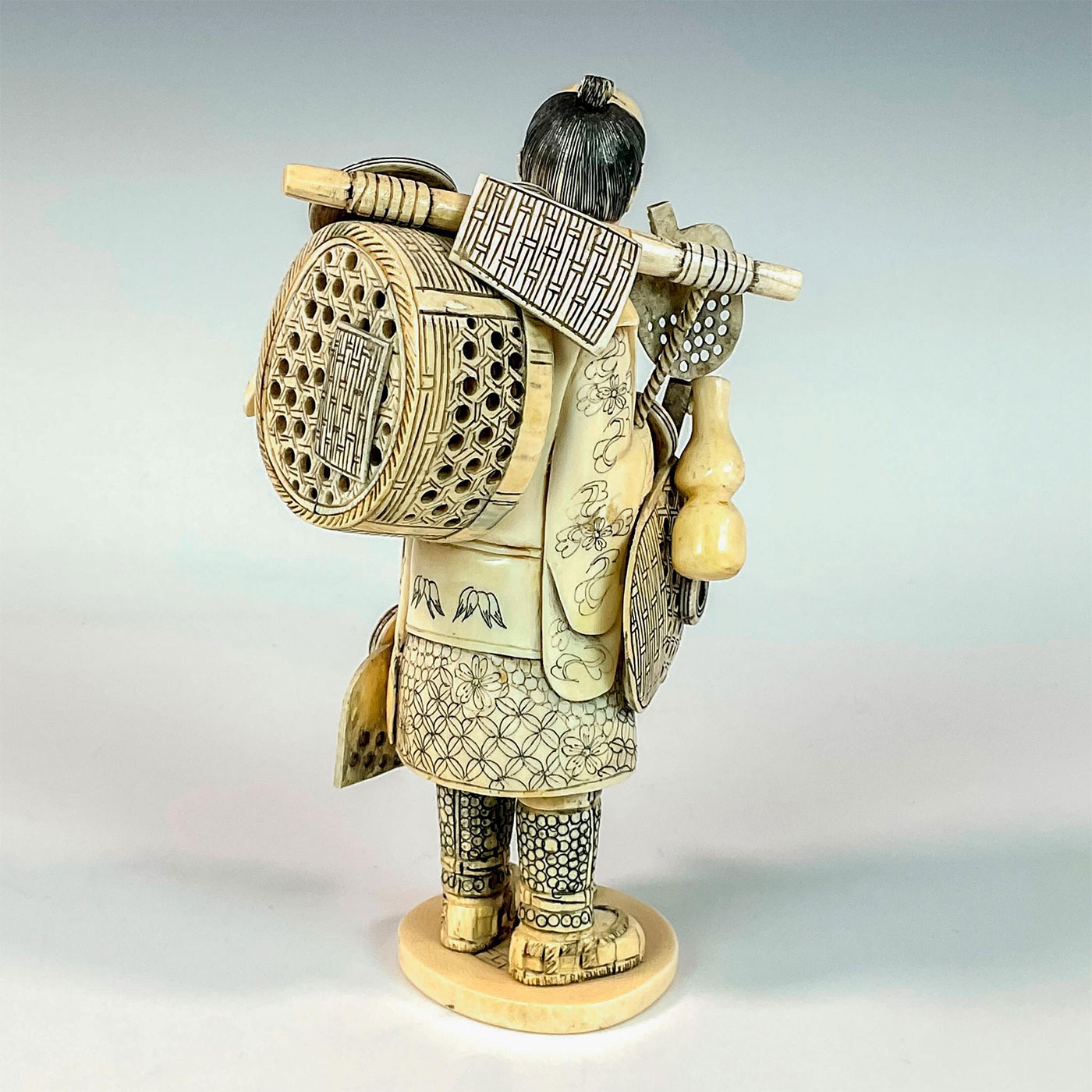Japanese School | FIGURINE OF A TRAVELING MERCHANT | MutualArt