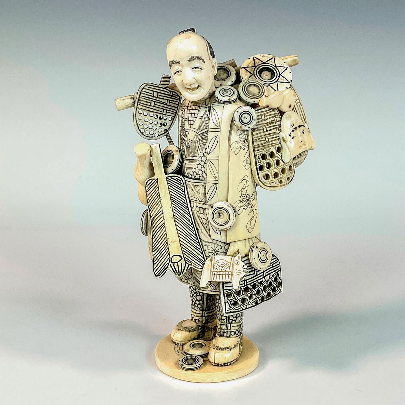 Japanese School | FIGURINE OF A TRAVELING MERCHANT | MutualArt