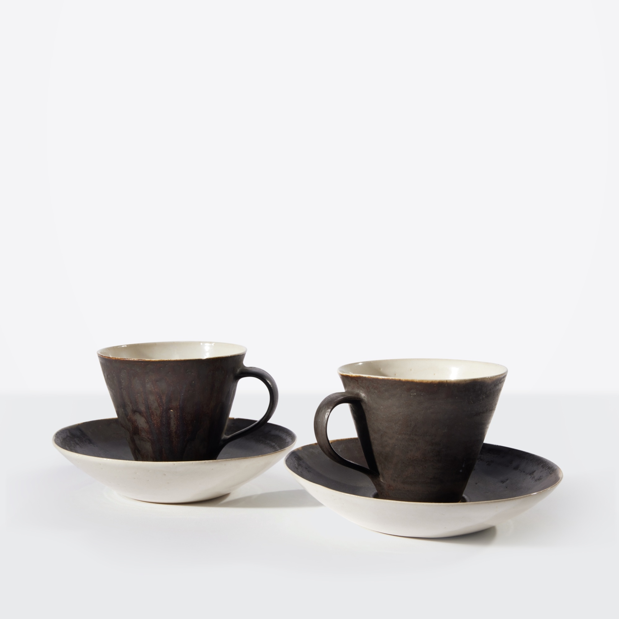 Lucie Rie | Two Teacups and Underplates (Circa 1960) | MutualArt