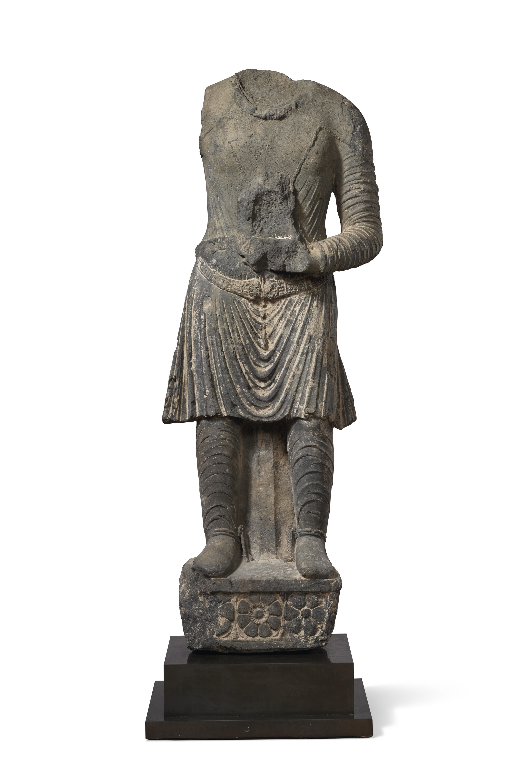 Gandharan School, 4th Century | A VERY RARE AND MONUMENTAL GREY SCHIST FIGURE OF A DONOR | MutualArt