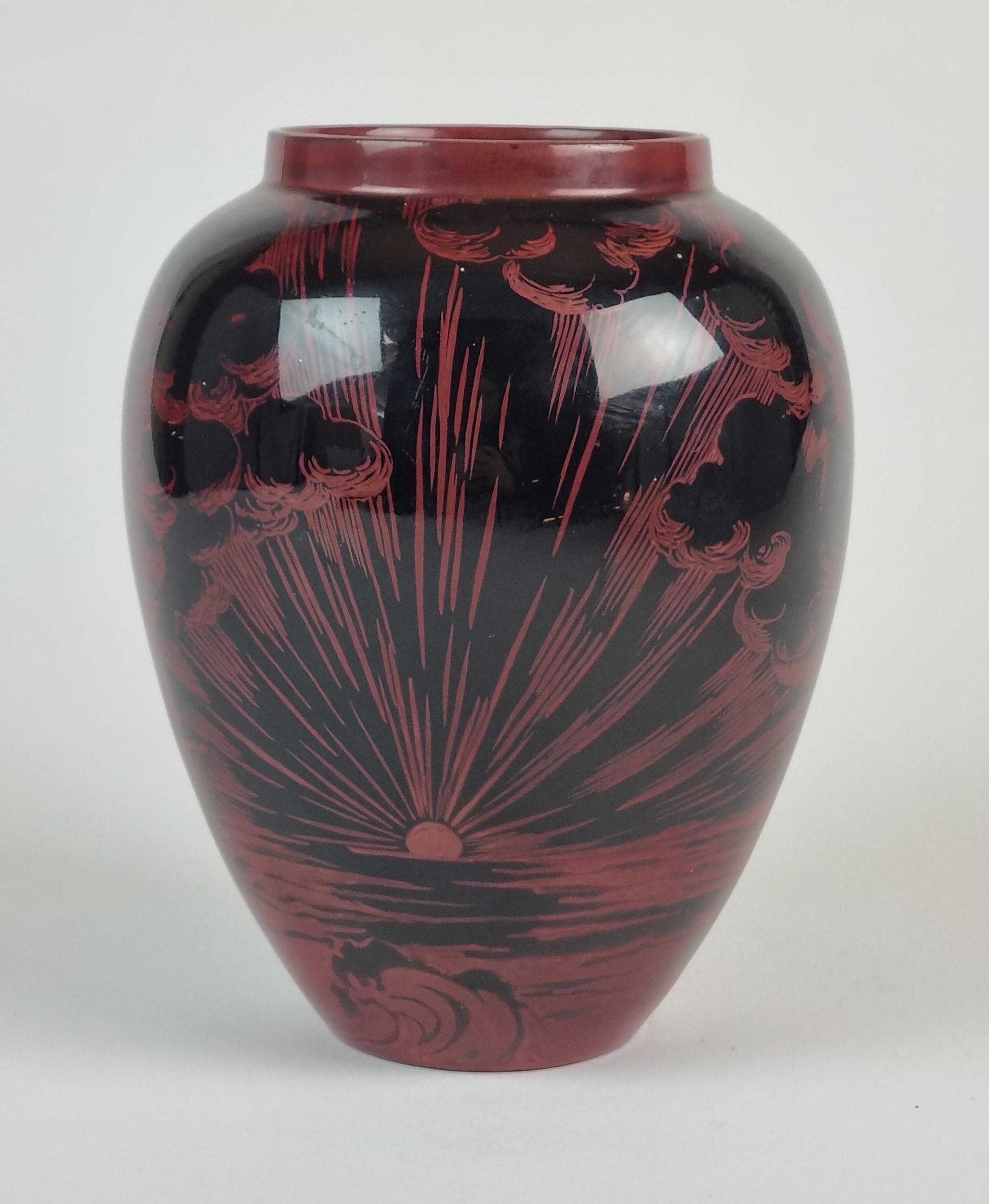 Bernard Moore | A red flambe vase decorated with two galleons in full sail and a sunset | MutualArt