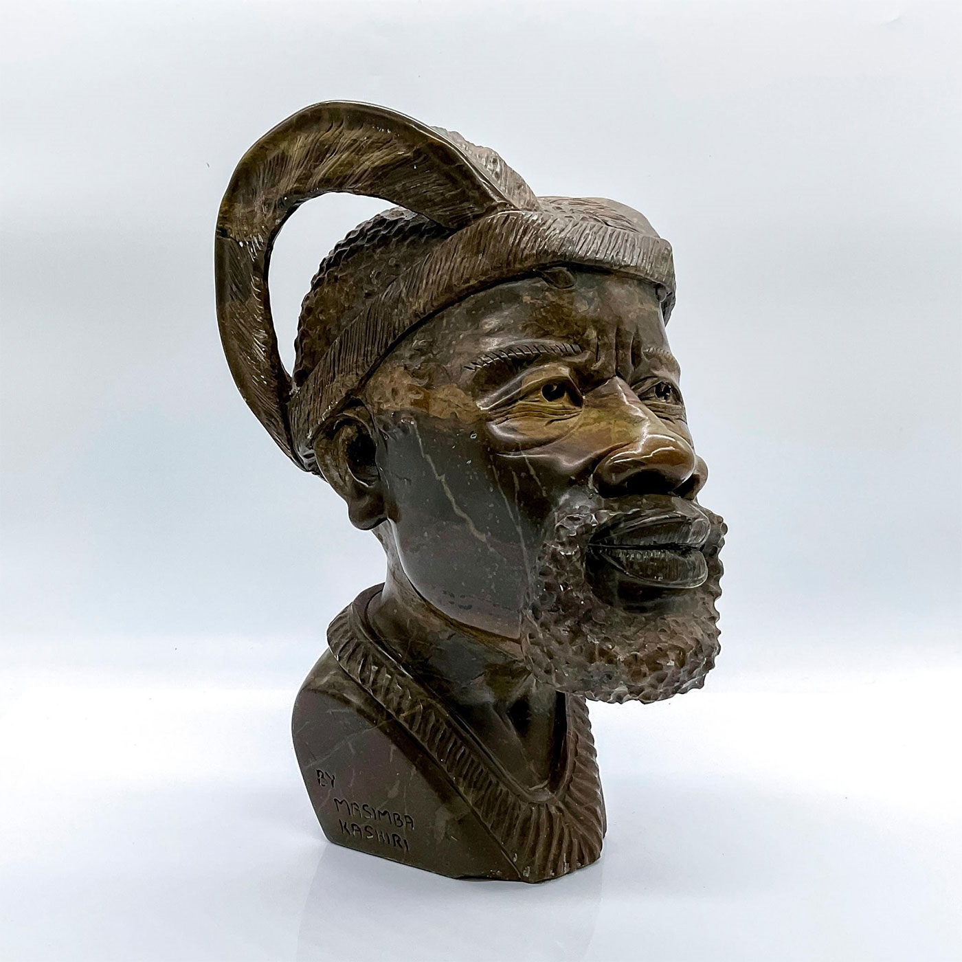 Masinba Kashiri | A beautiful green stone sculpture of a bearded man in ...