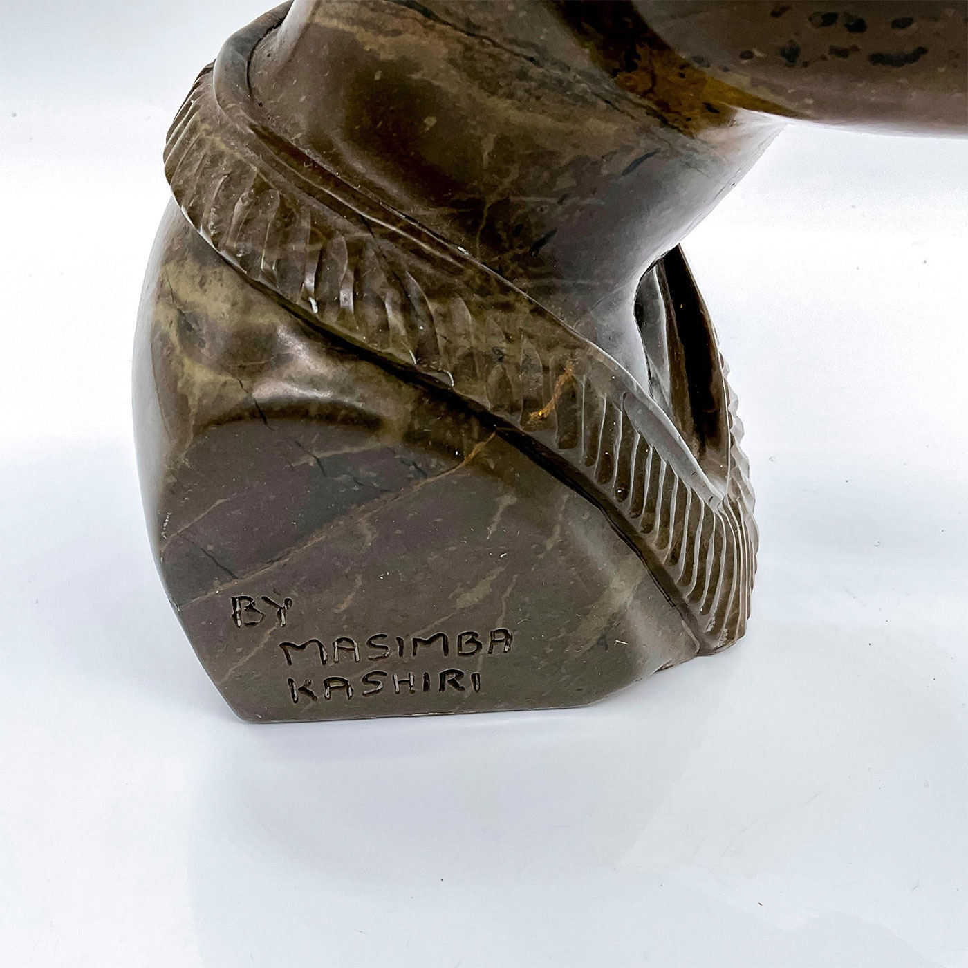 Masinba Kashiri | A beautiful green stone sculpture of a bearded man in ...