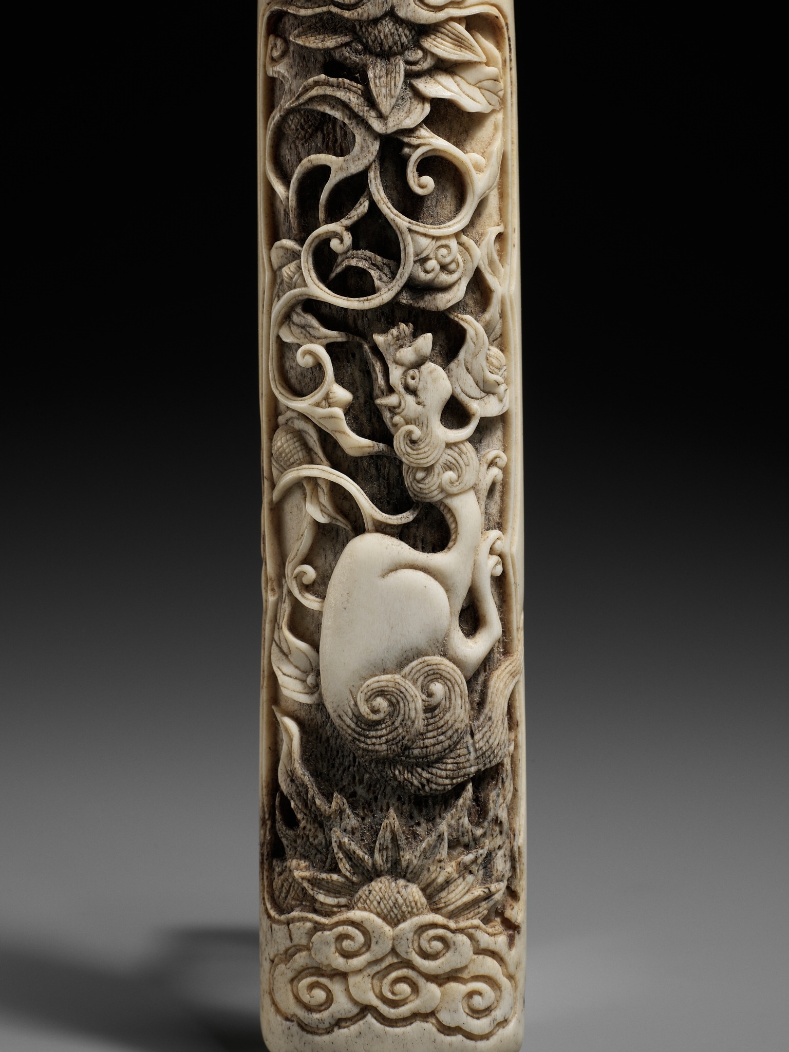 Ozaki Kokusai | A STAG ANTLER KISERUZUTSU DEPICTING A KIRIN AND SHISHI ...