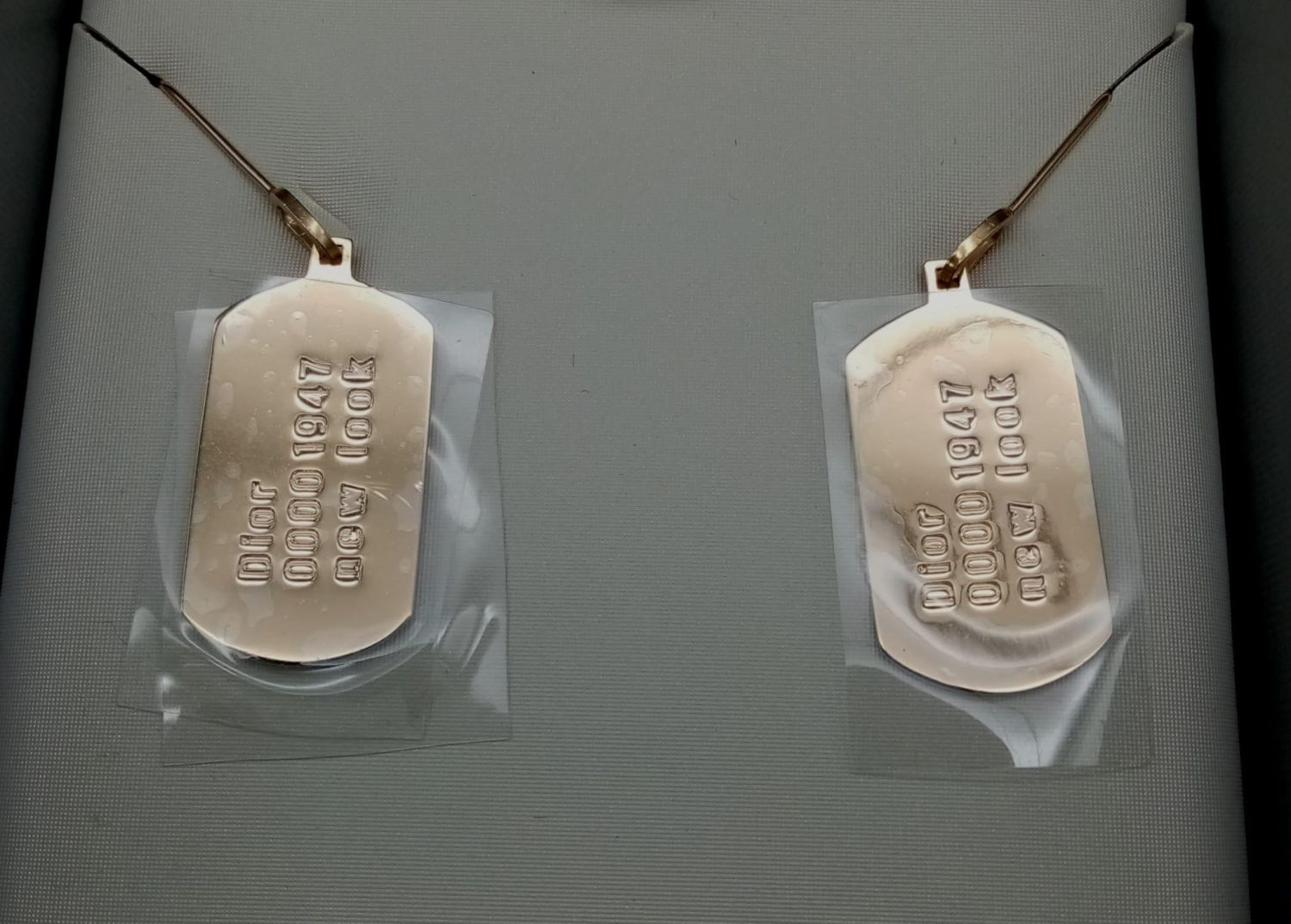 Christian Dior | A Pair of Christian Dior Gilded Tag Earrings ...