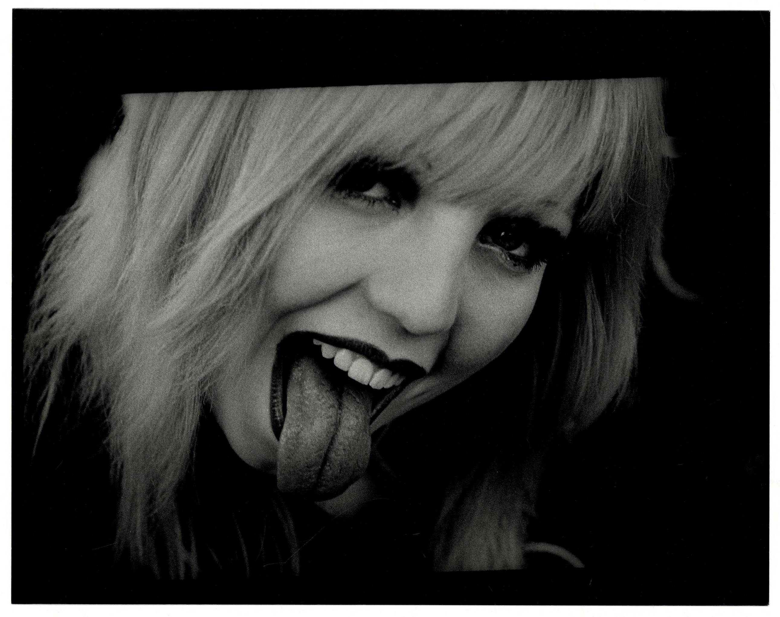 Jan Saudek | Young woman sticking out her tongue | MutualArt