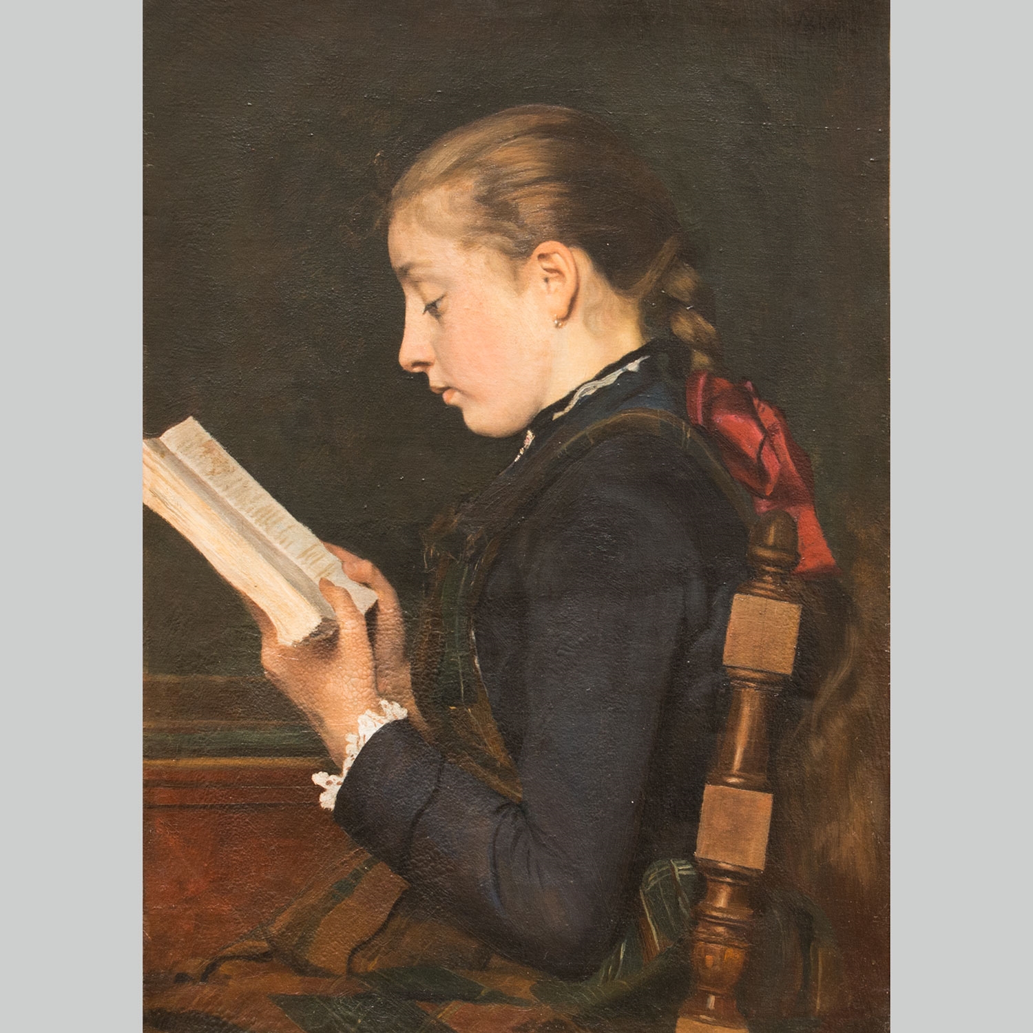 Albert Anker | Portrait of a girl reading a book sitting on the chair ...