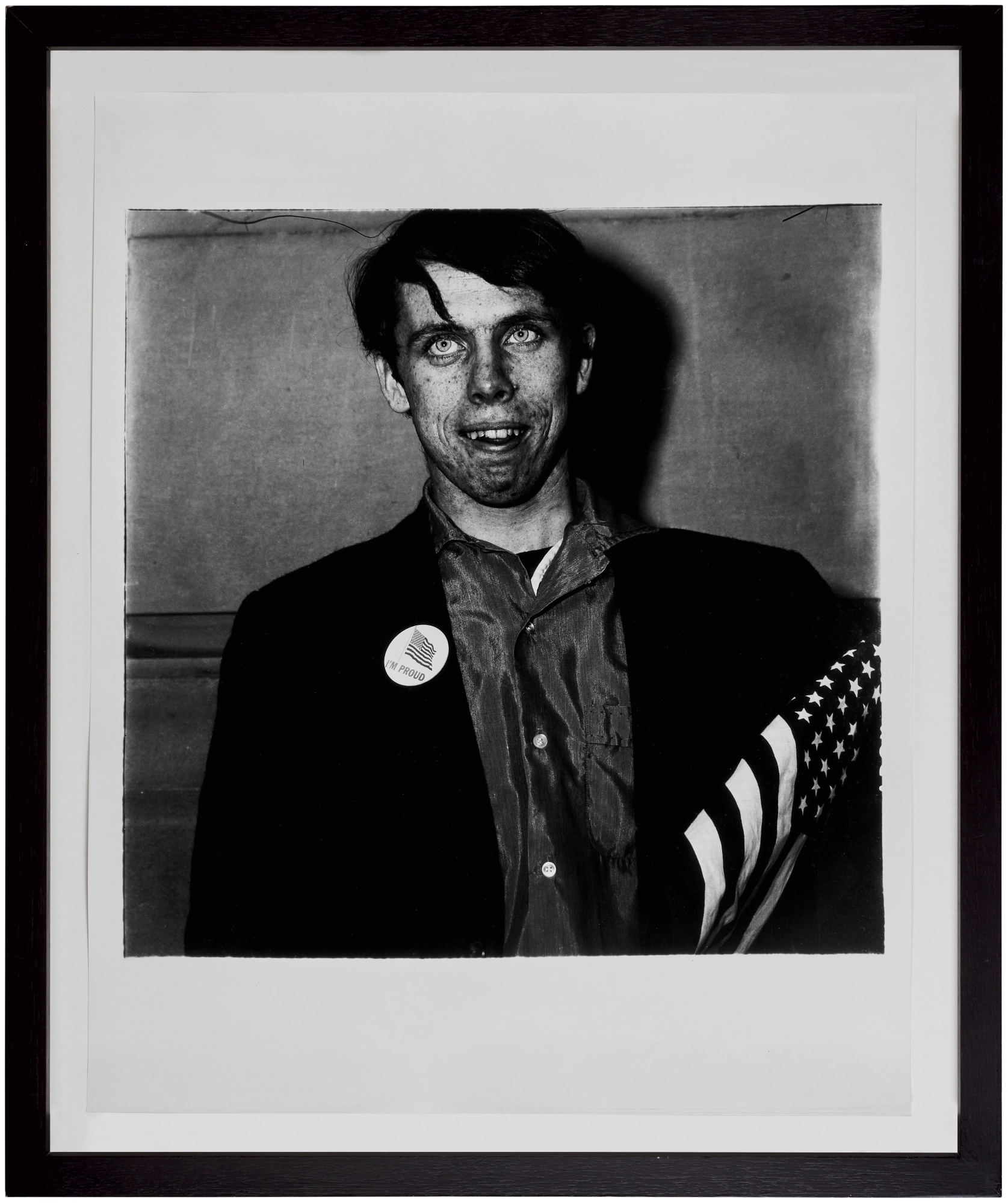 Diane Arbus | Patriotic Young Man with a Flag, N.Y.C. (1967) | MutualArt