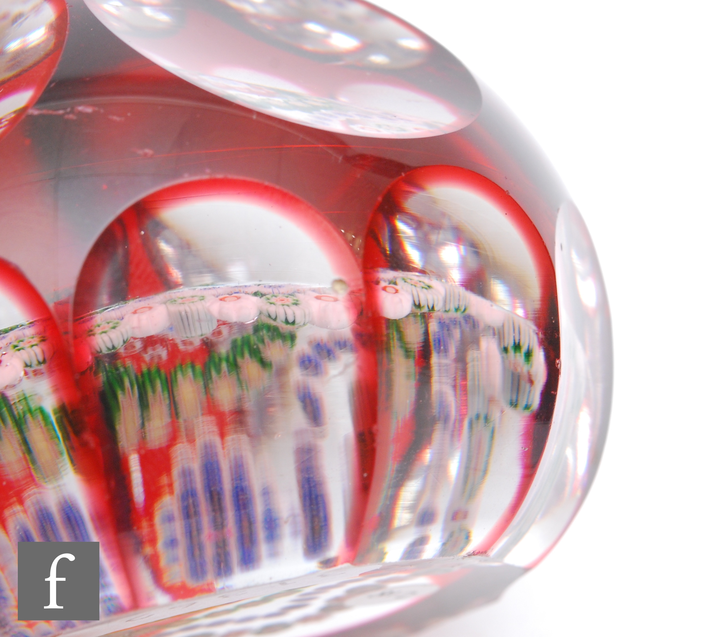 Baccarat | A Baccarat glass overlay paperweight internally decorated ...