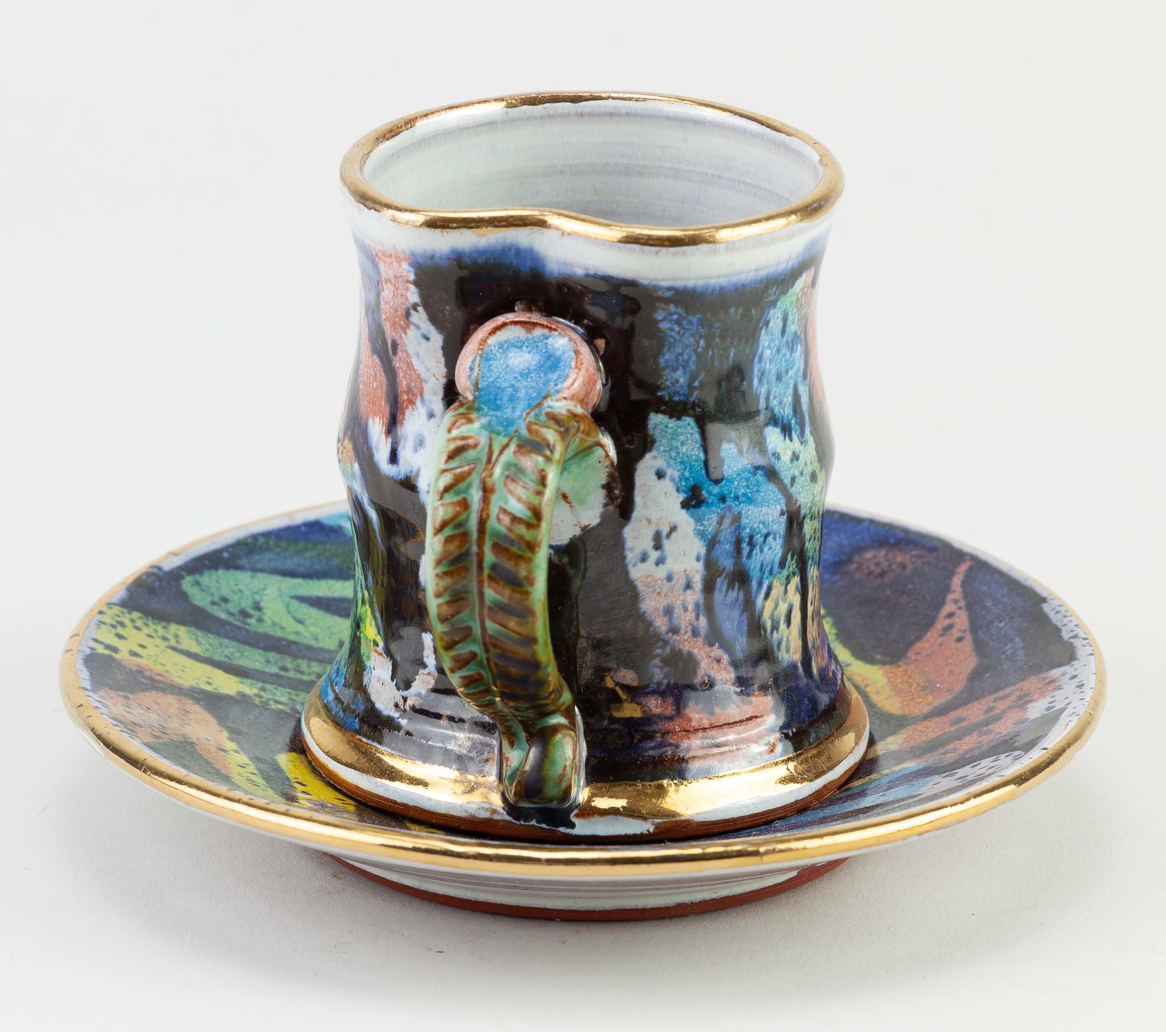 David Constantine | a slip decorated cup and saucer | MutualArt