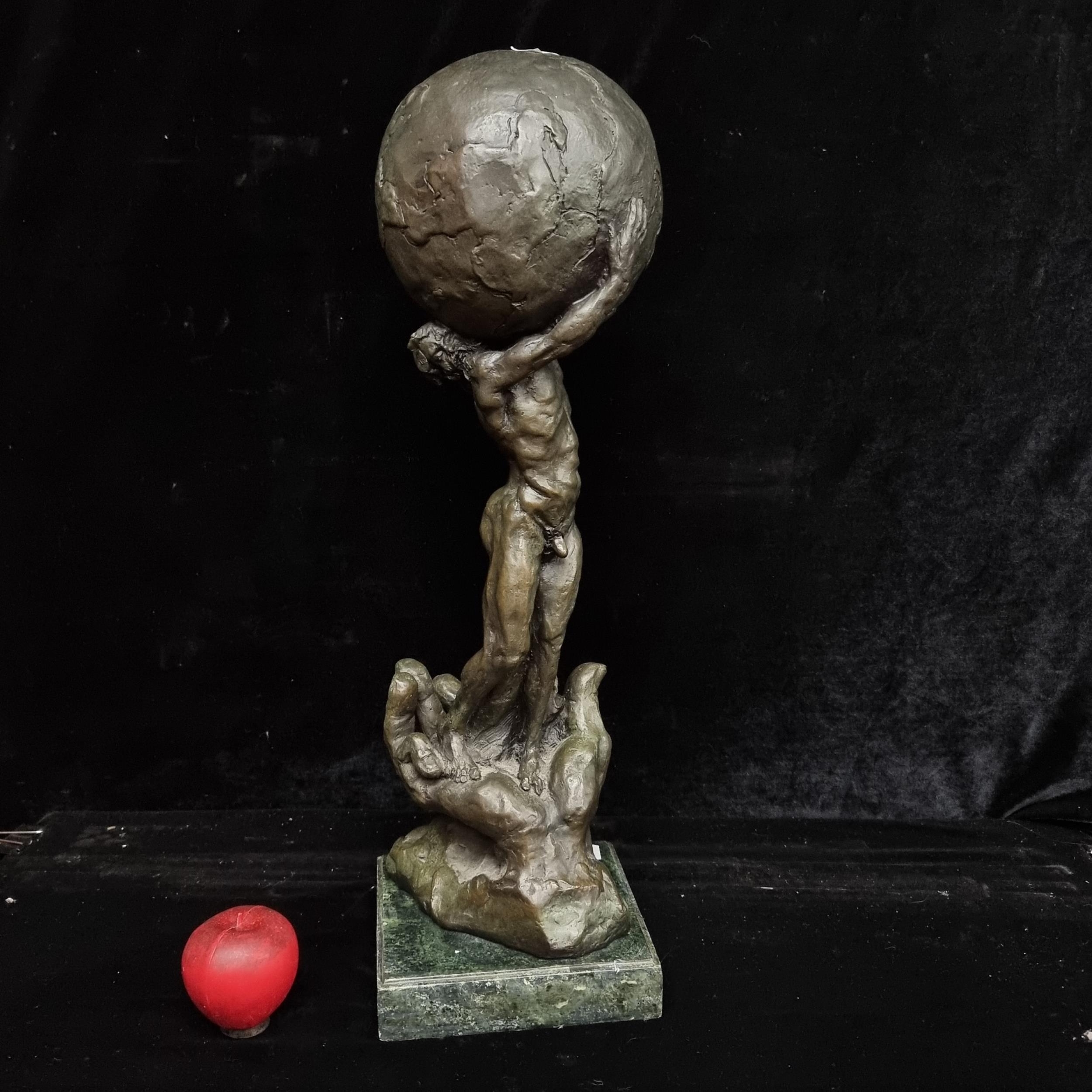 Female Atlas Holding The World