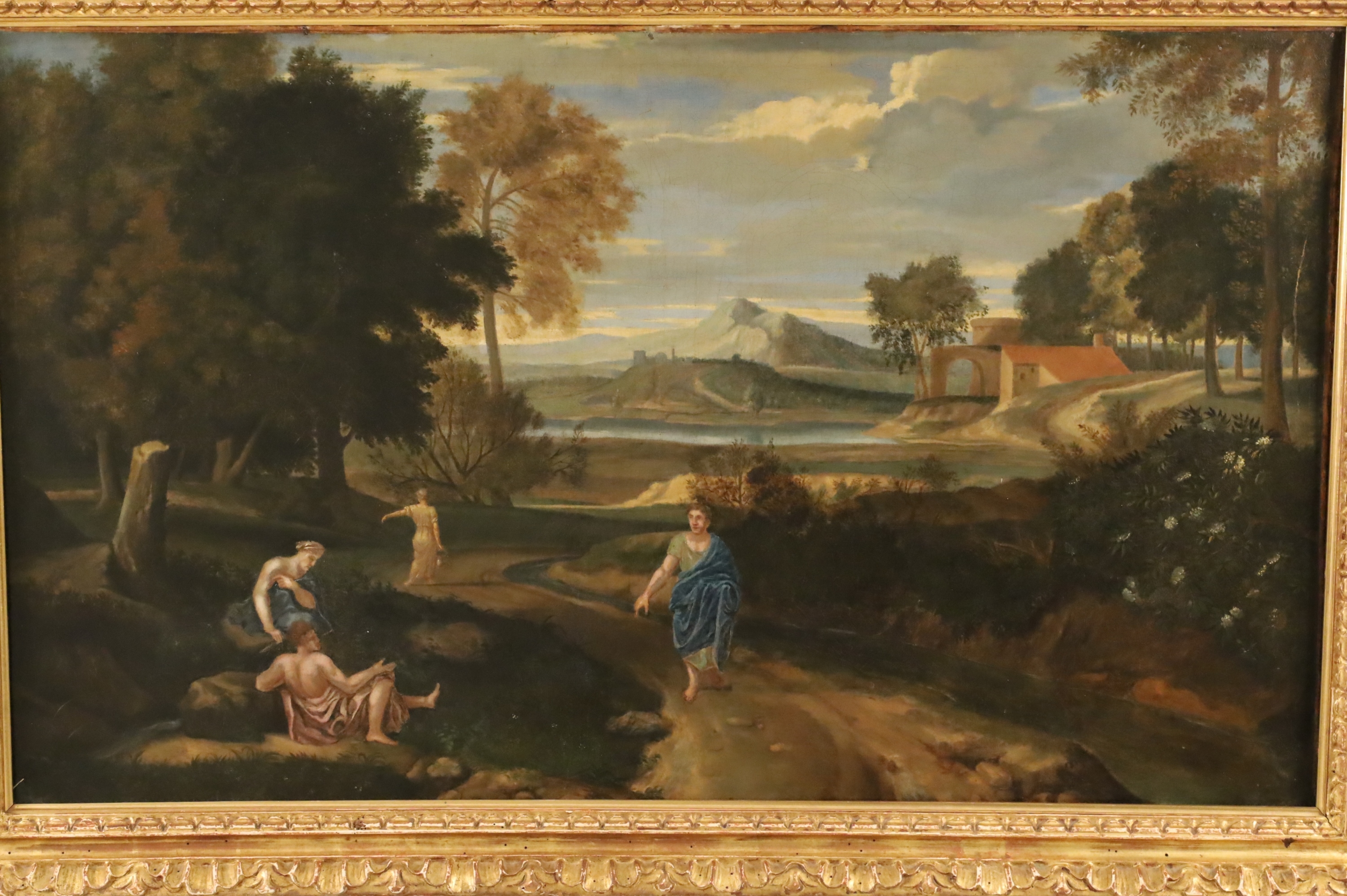 Gaspard Dughet | Figures along a path with structures near a lake and ...