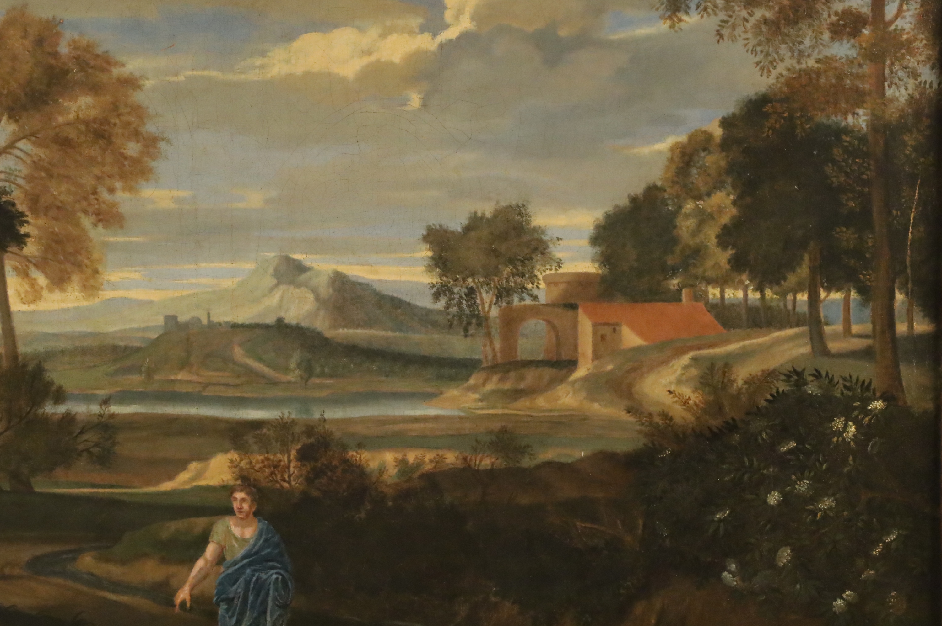 Gaspard Dughet | Figures along a path with structures near a lake and ...
