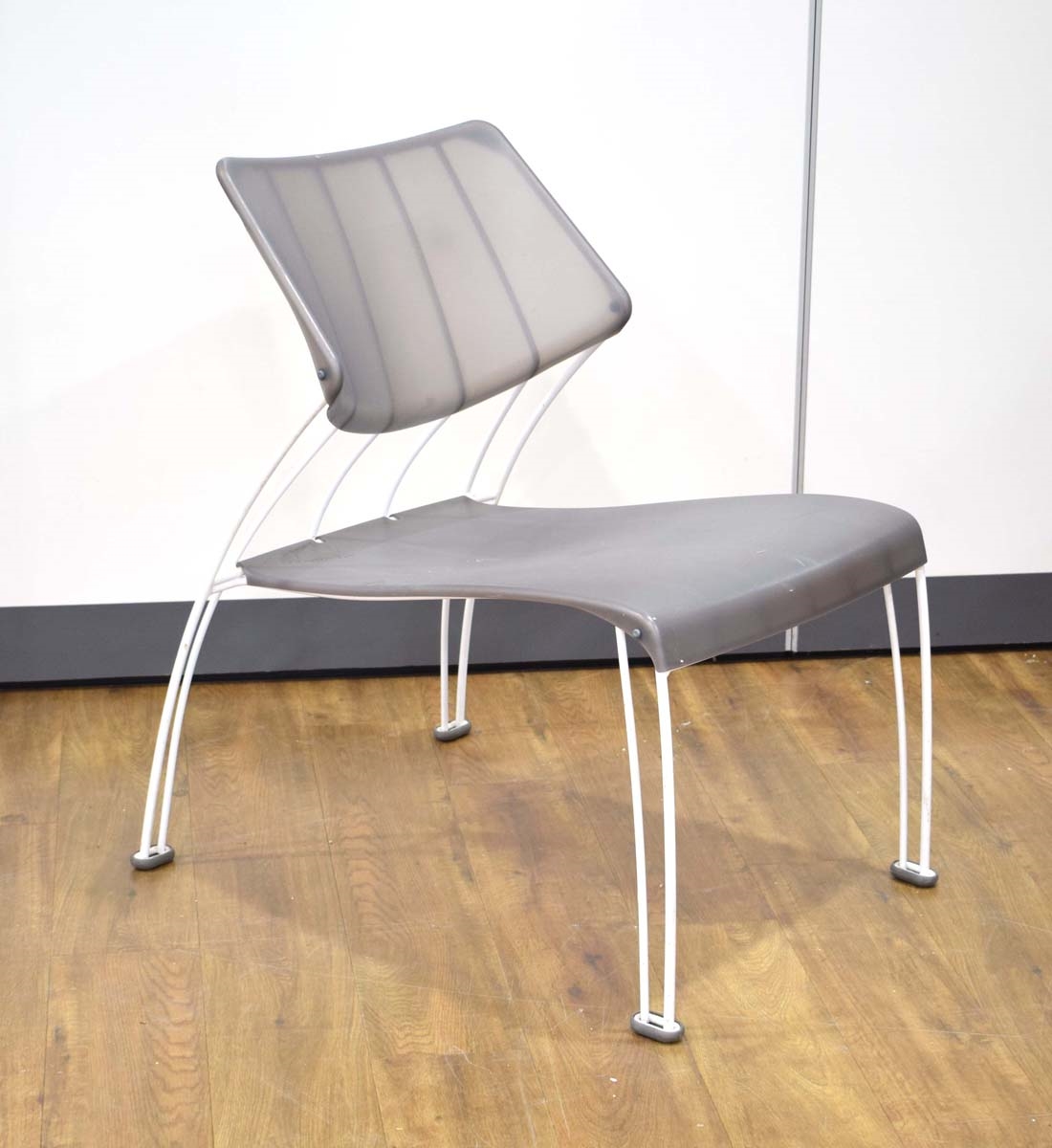 Monika Mulder | a 1990's Hasslo lounge chair in grey with a white ...