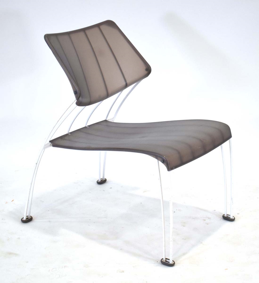 Monika Mulder | a 1990's Hasslo lounge chair in grey with a white ...