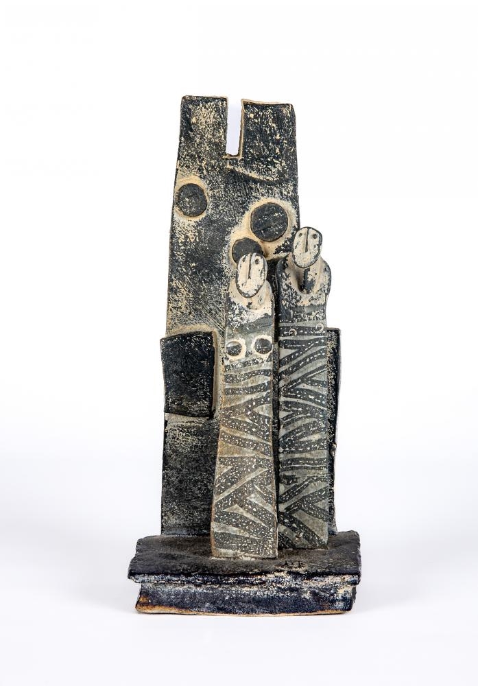 John Maltby | - a matt grey stoneware sculpture of two figures standing ...