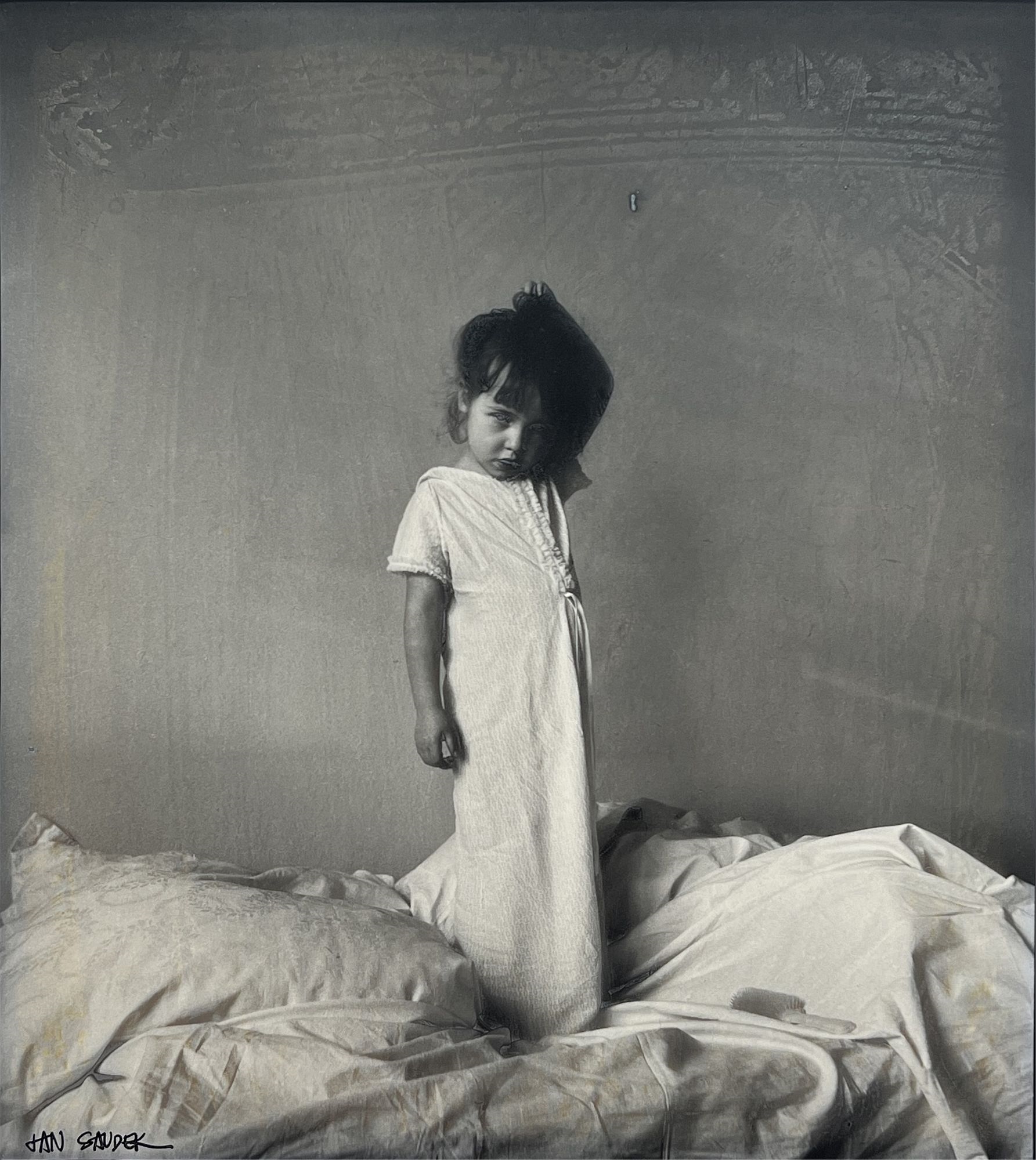 Jan Saudek | Child Standing on Bed | MutualArt